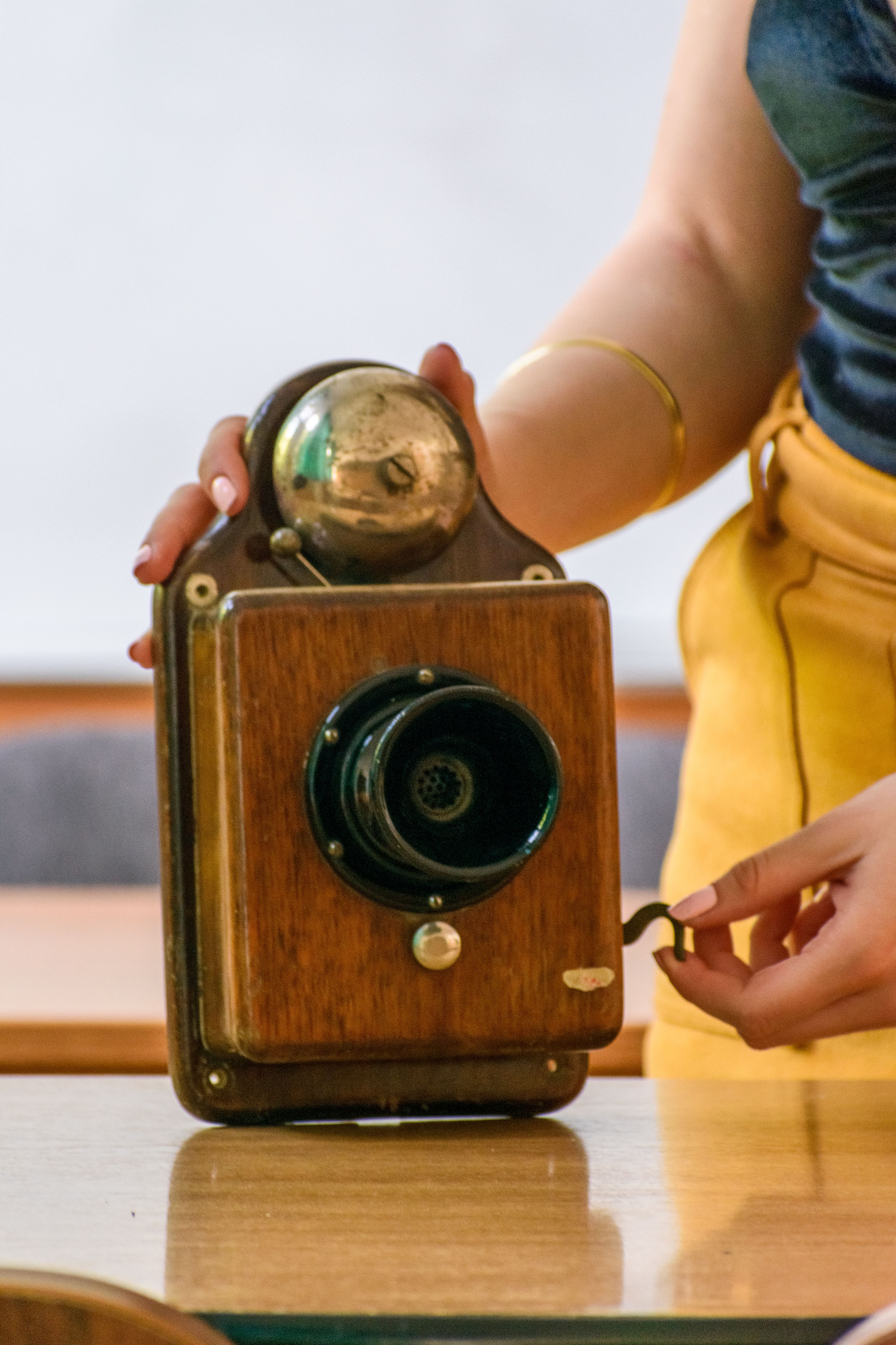 Person Holding a Vintage Intercom · Free Stock Photo