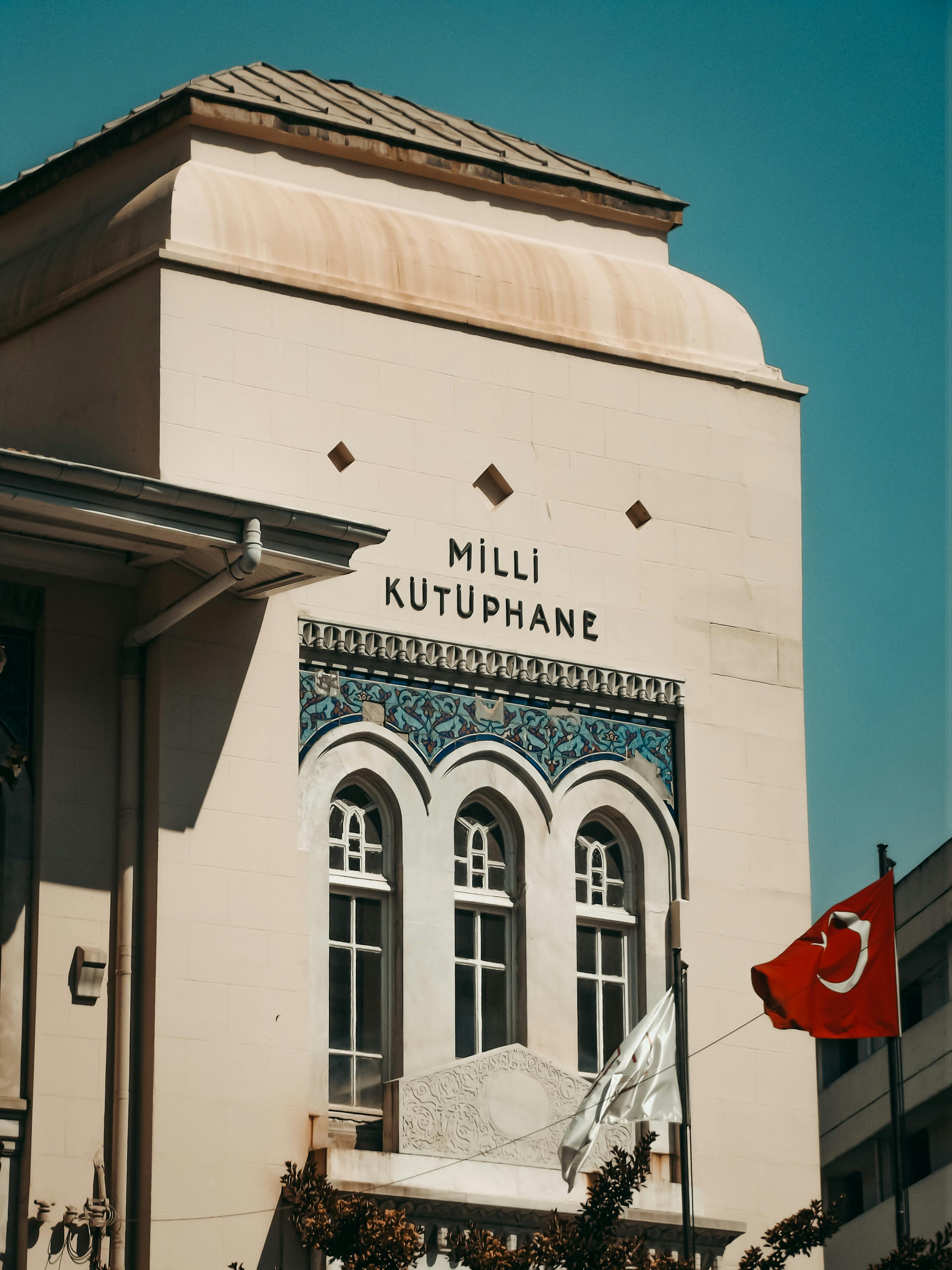 Concrete Building Beside a Turkish Flag · Free Stock Photo