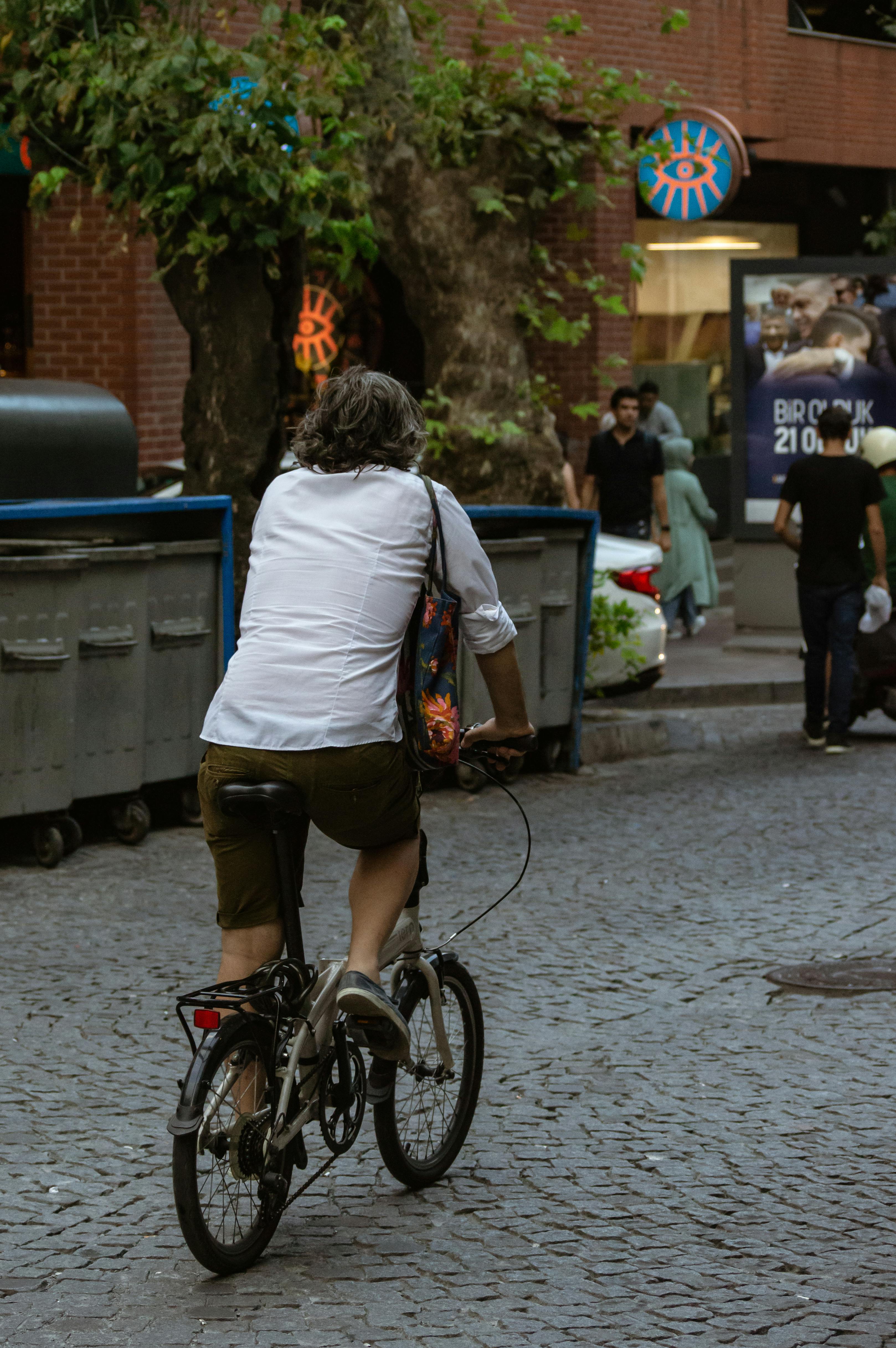 Backview of Person riding a Bicycle · Free Stock Photo