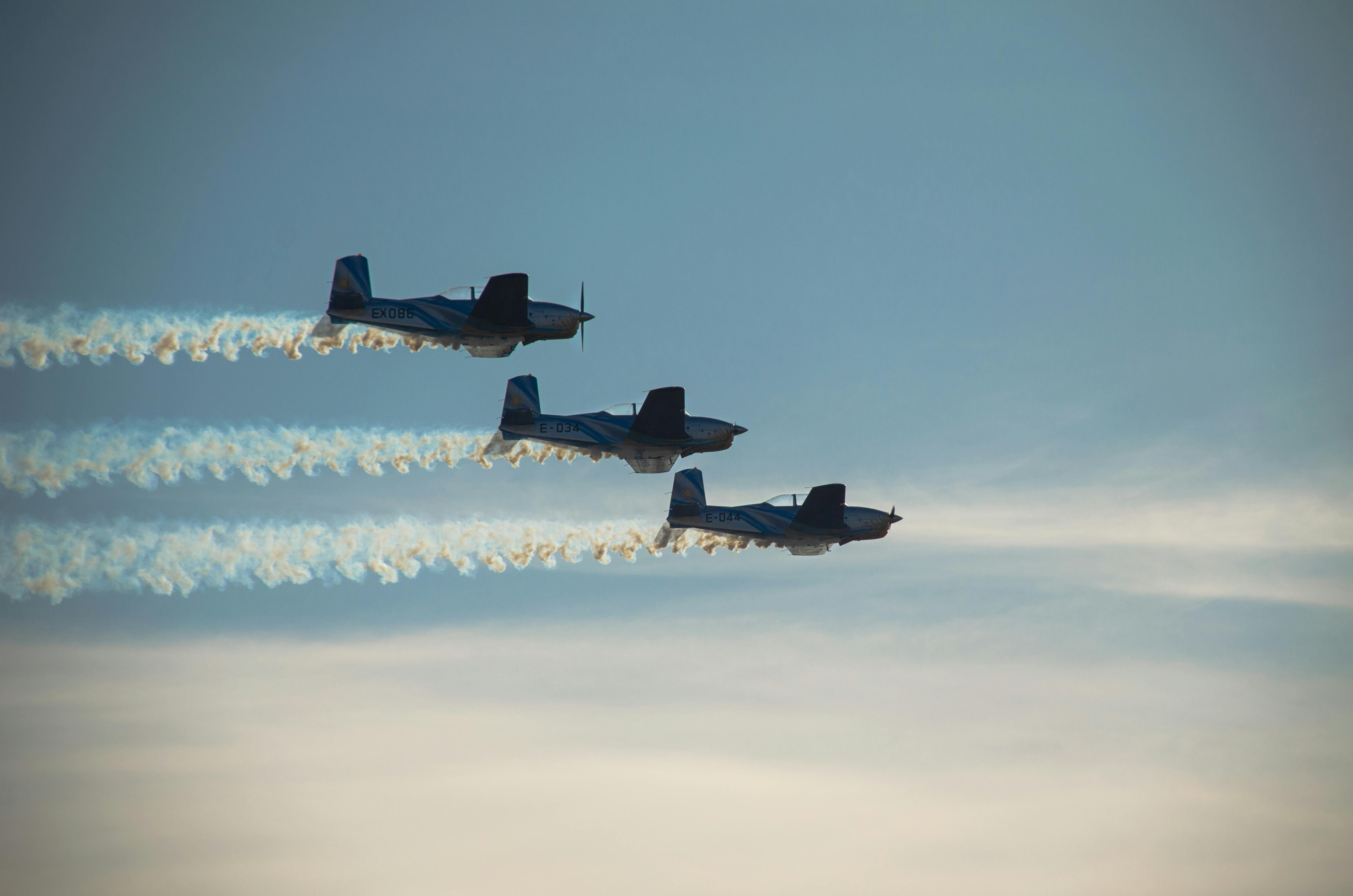 Fighter Jet Flying under Gray Sky · Free Stock Photo