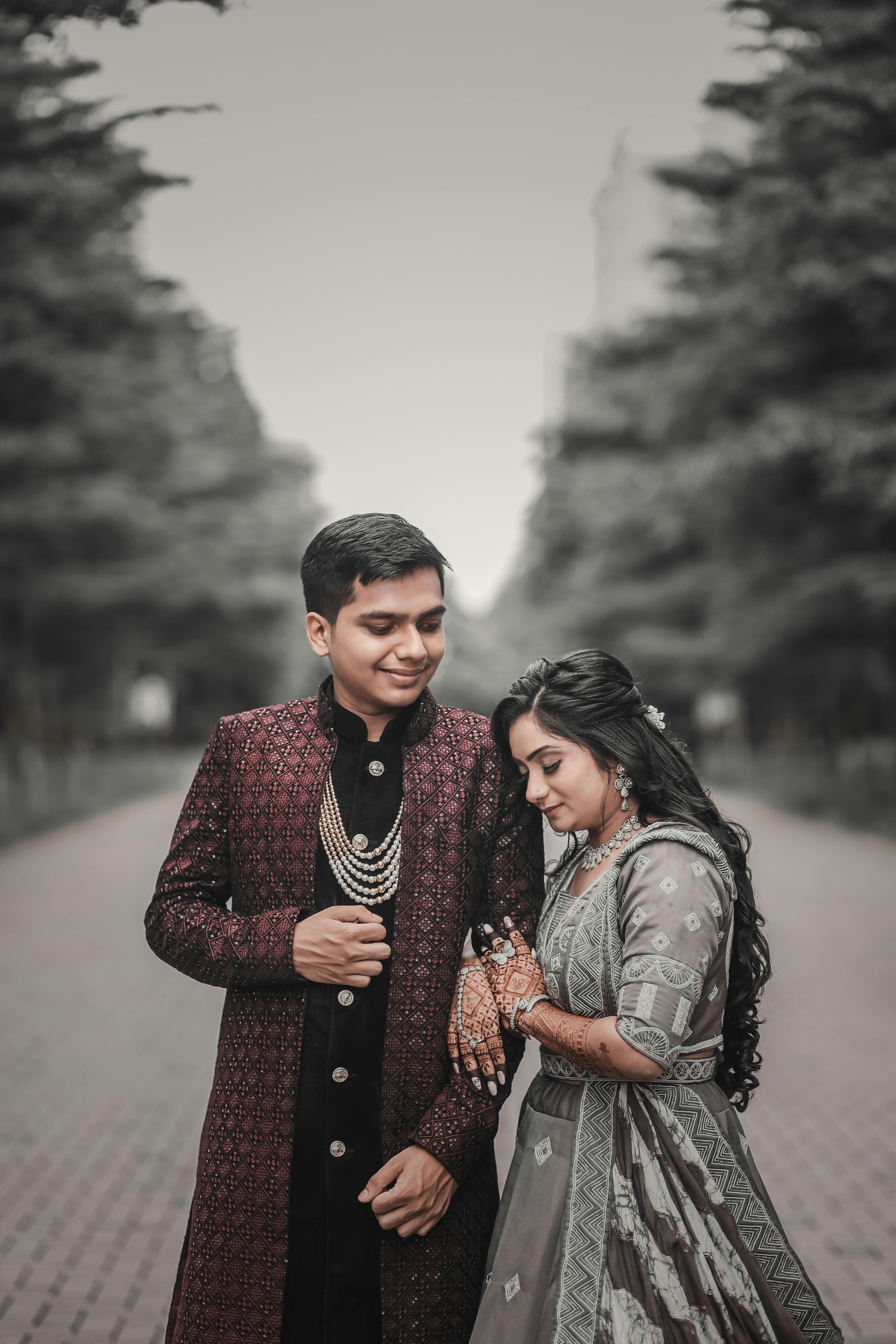 A Sweet Couple Wearing Traditional Outfit Standing Beside Each Other ...