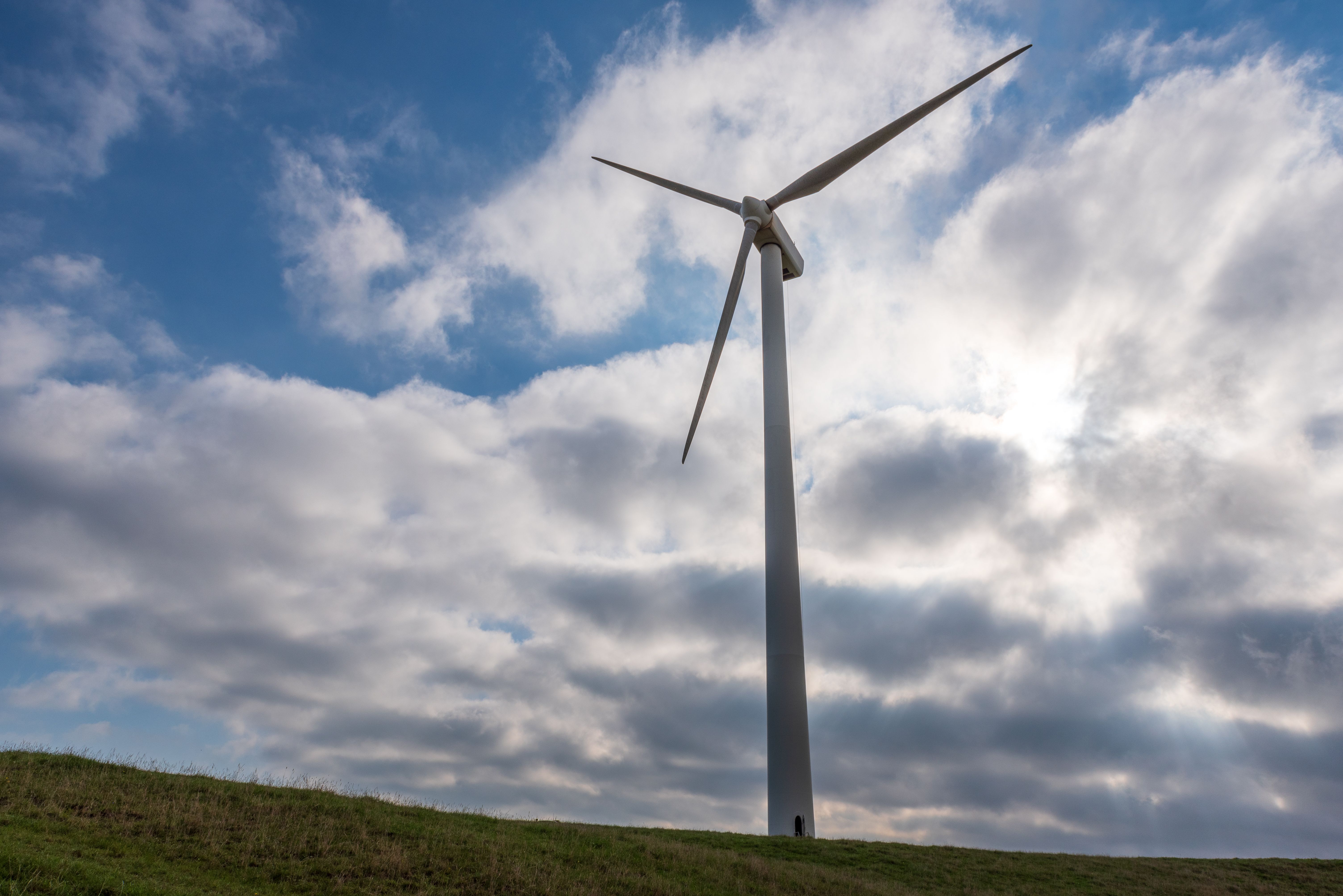 White 3-blade Windmill Under Cloudy Sky · Free Stock Photo