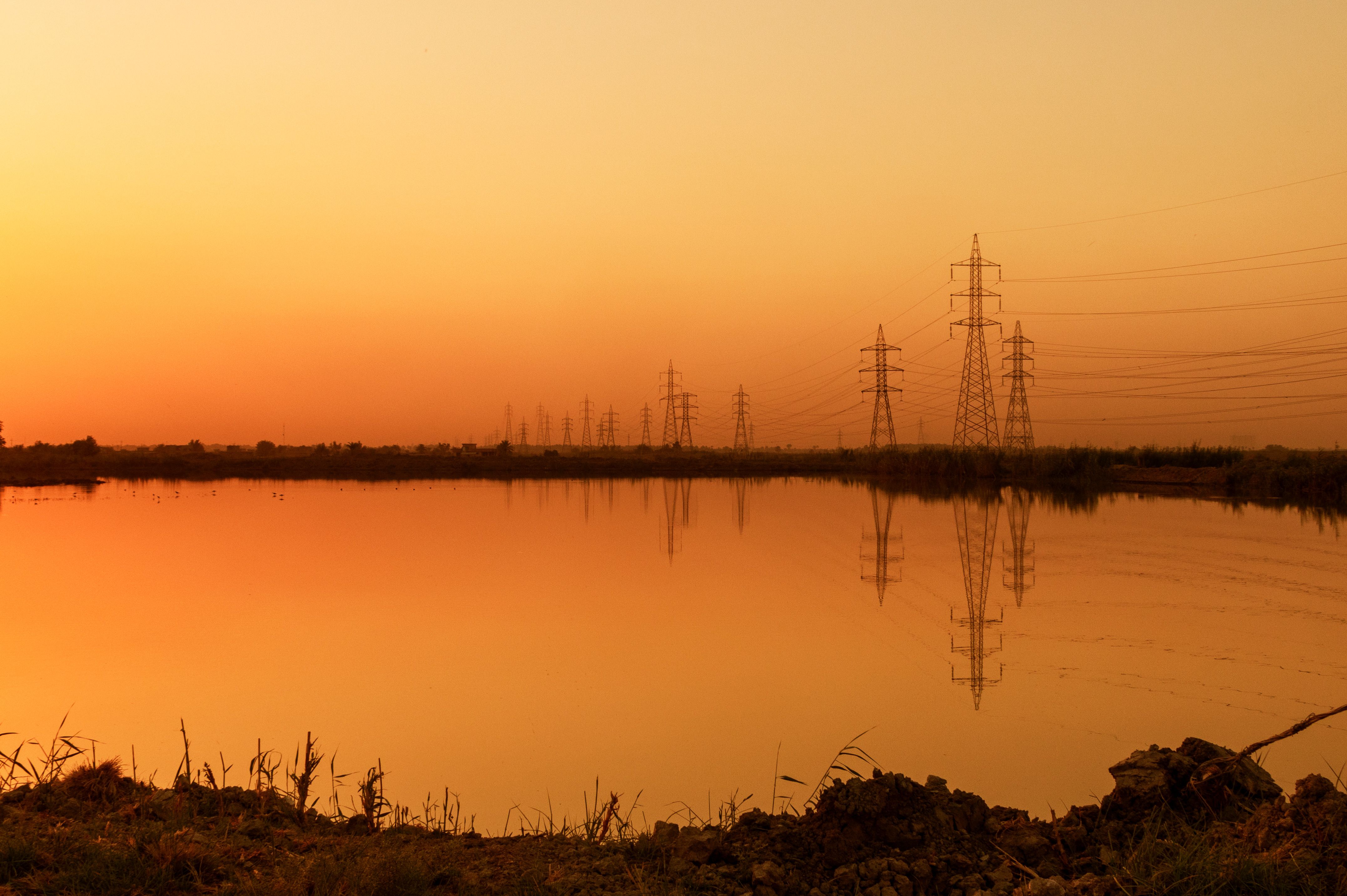 Reflection of Transmission Towers on Water Surface · Free Stock Photo