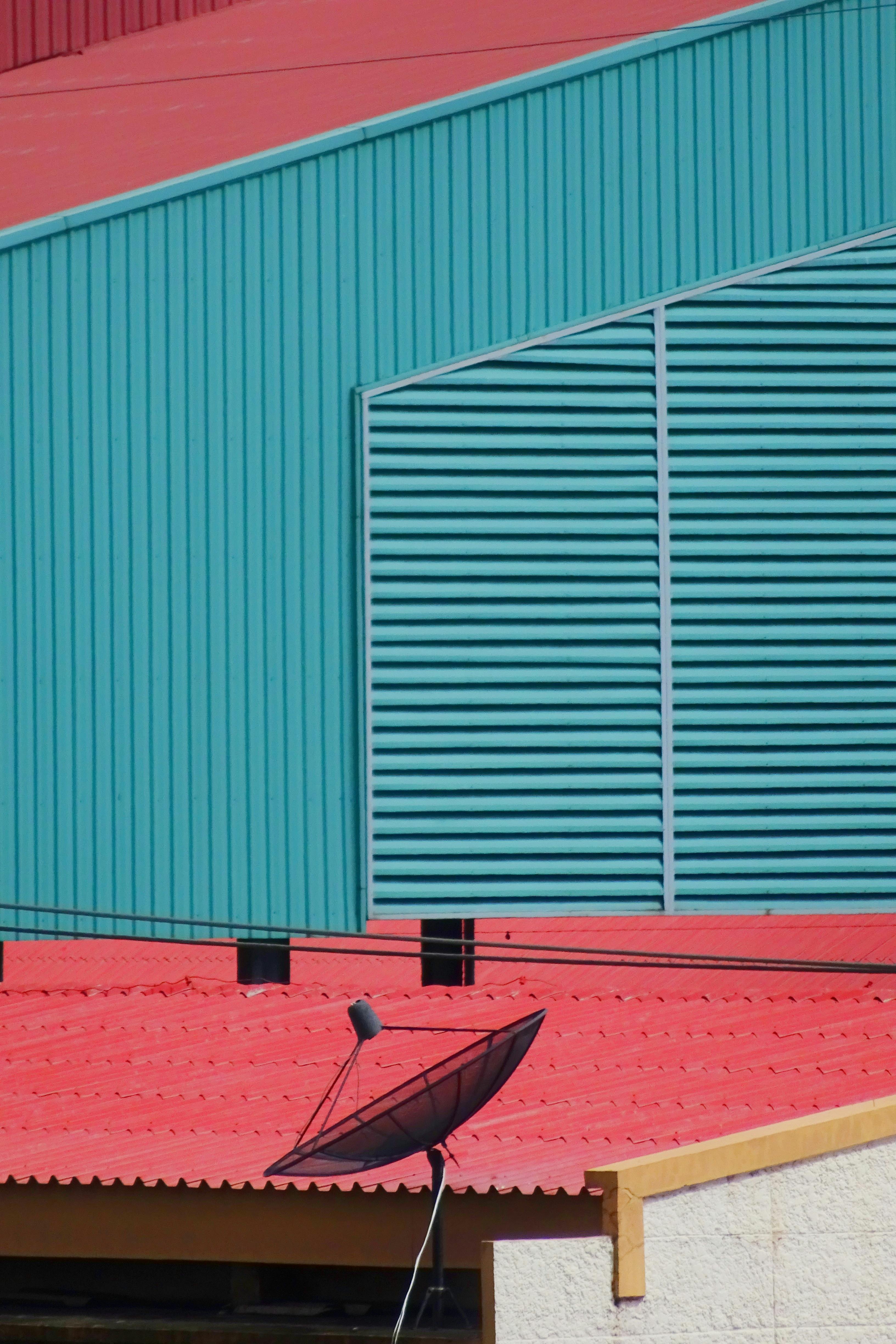 Pink and Blue Building Exterior and Rooftop · Free Stock Photo