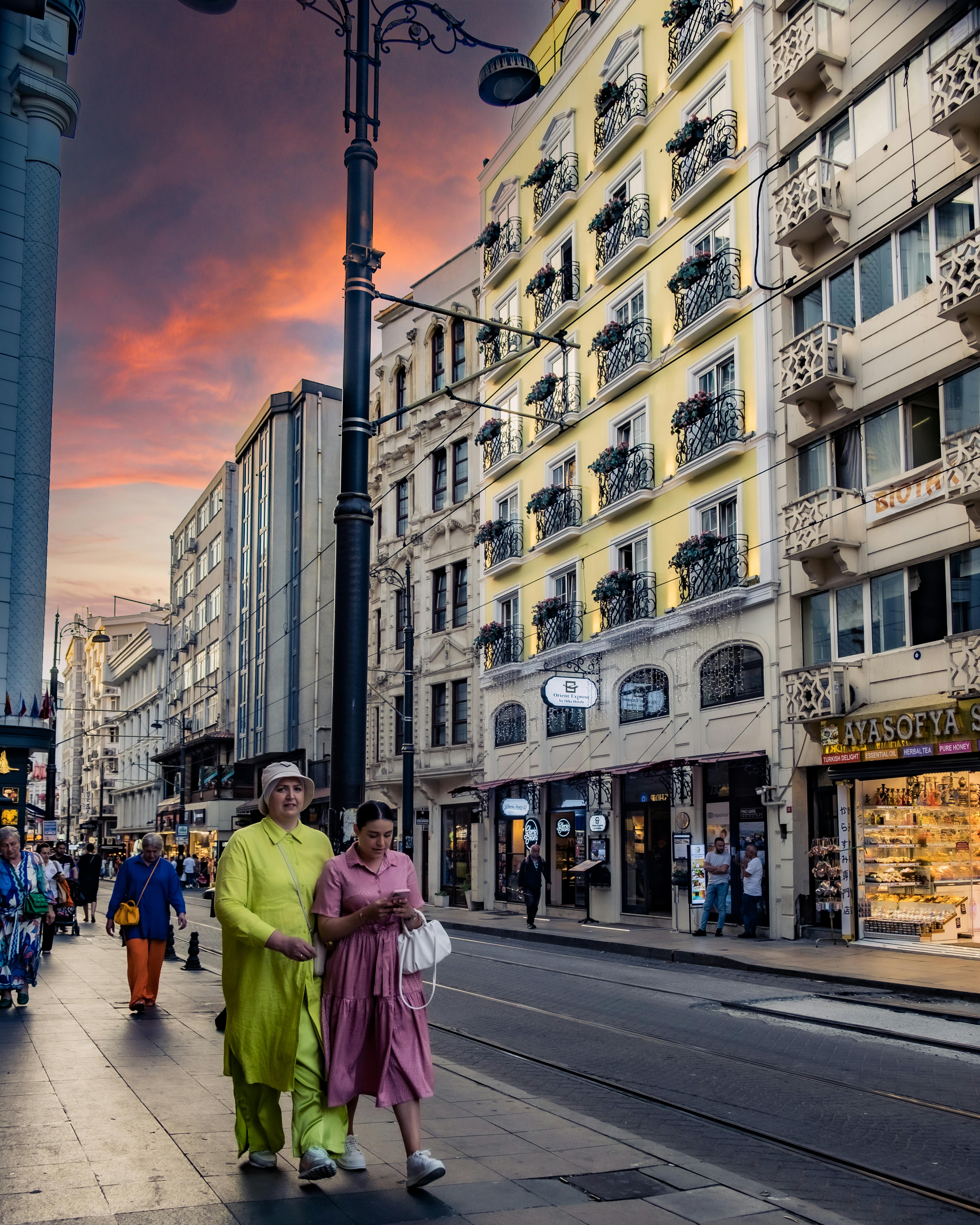Women Walking on Sidewalk in City · Free Stock Photo