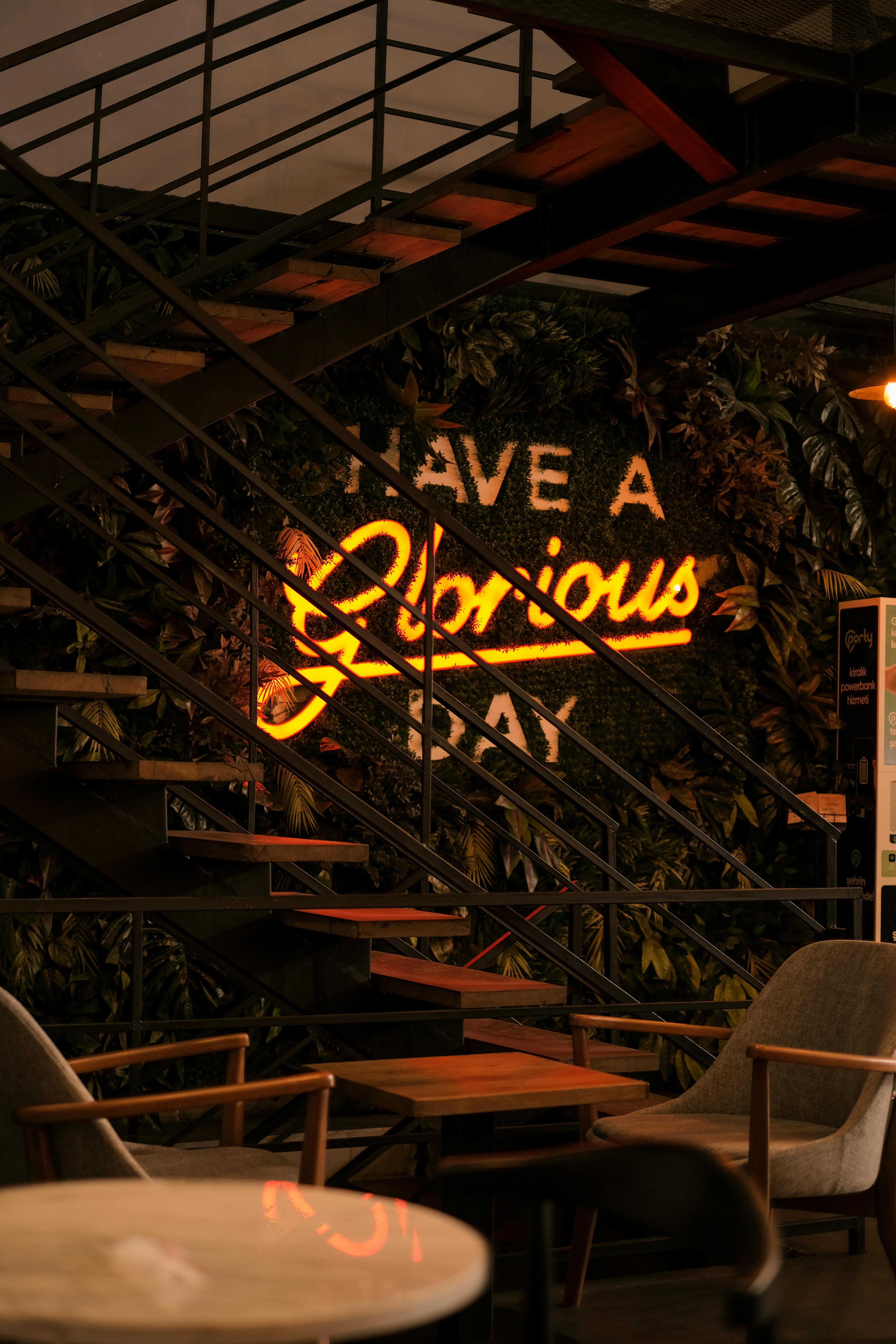 Illuminated Text Sign on the Wall · Free Stock Photo