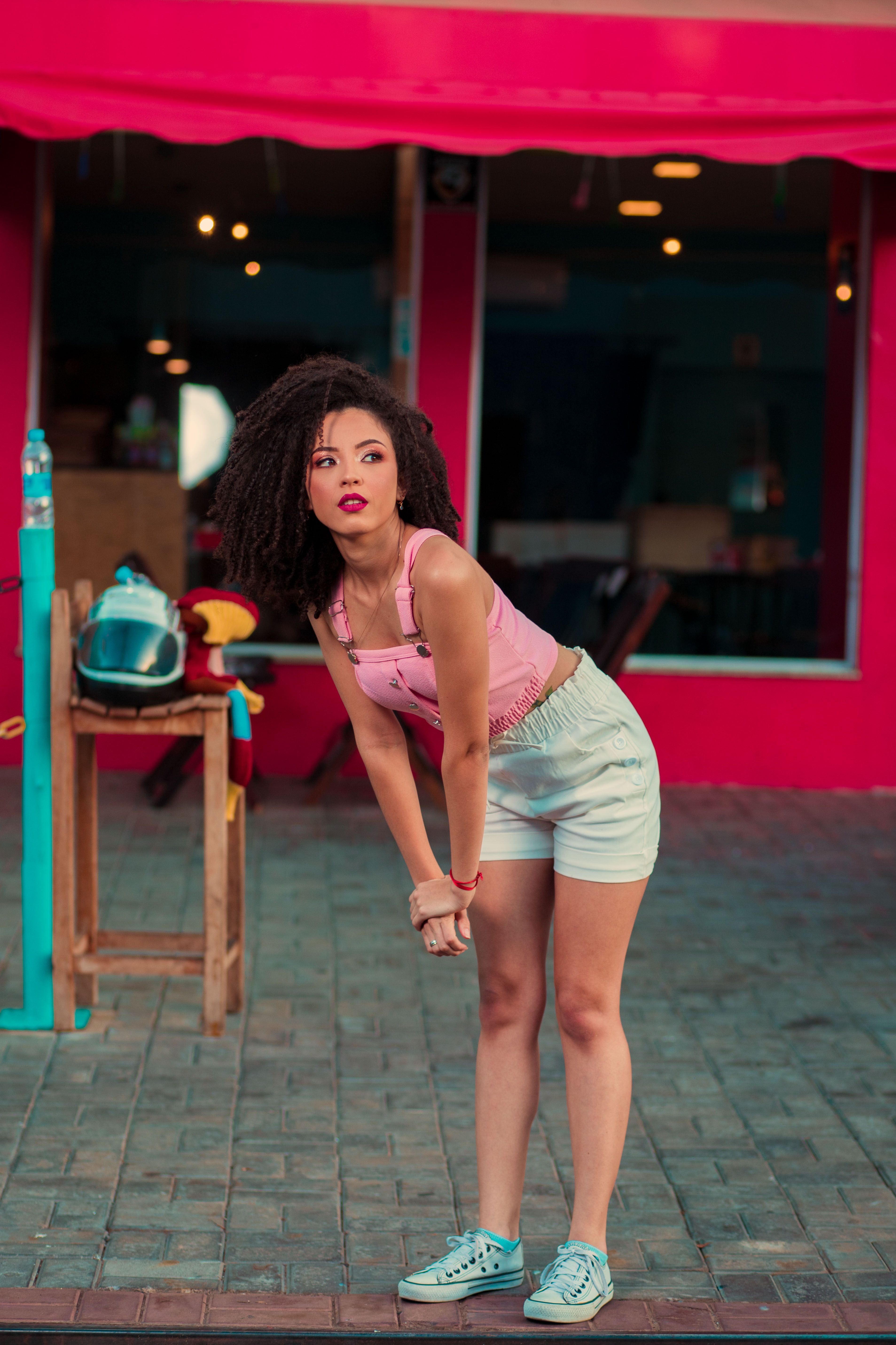 Beautiful Woman in White Shorts Posing Looking Afar · Free Stock Photo