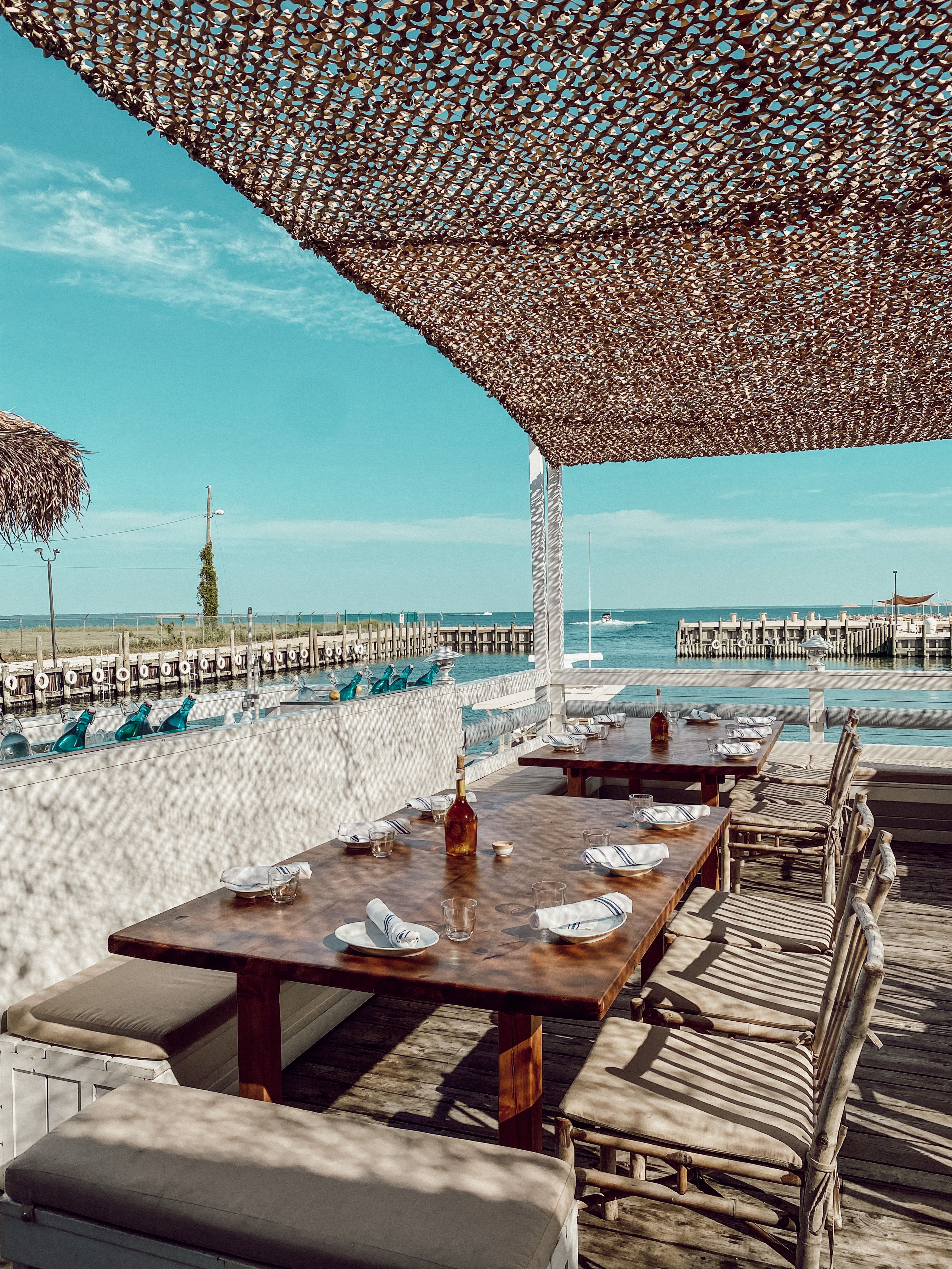 Brown Wooden Table With Chairs and Table near Sea · Free Stock Photo