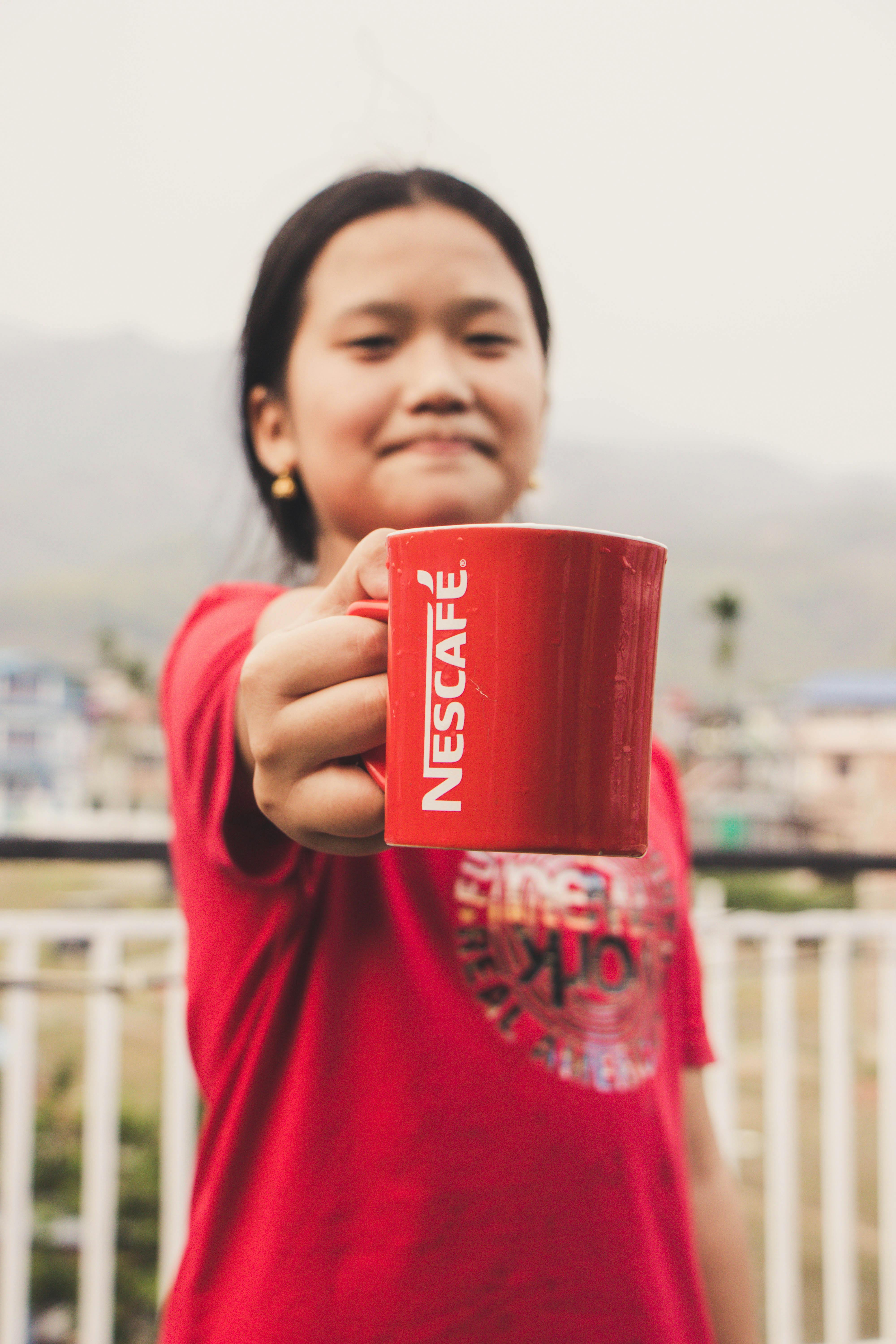 A Bearded Man Holding a Coffee · Free Stock Photo