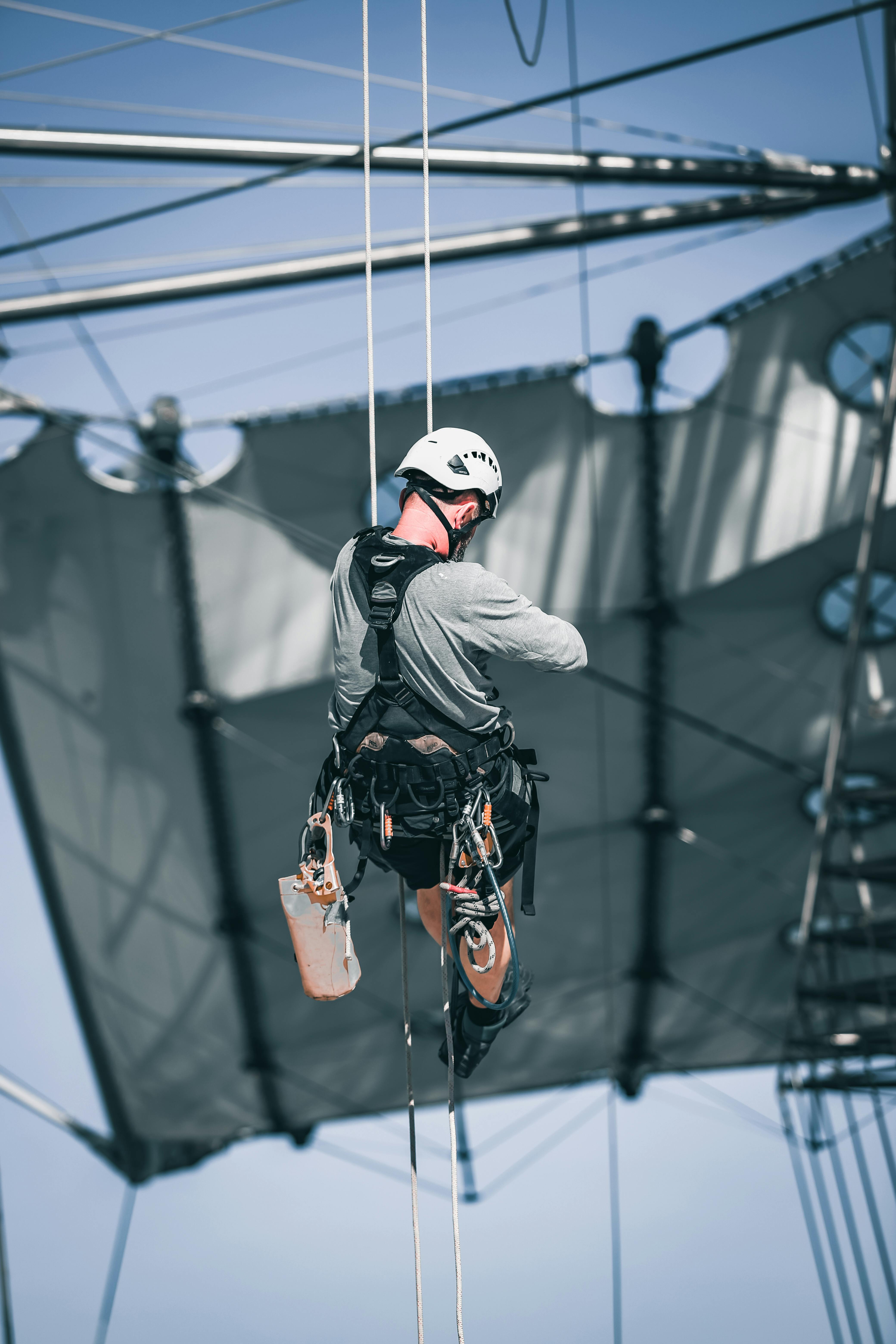 A Man Hanging on the Rope · Free Stock Photo