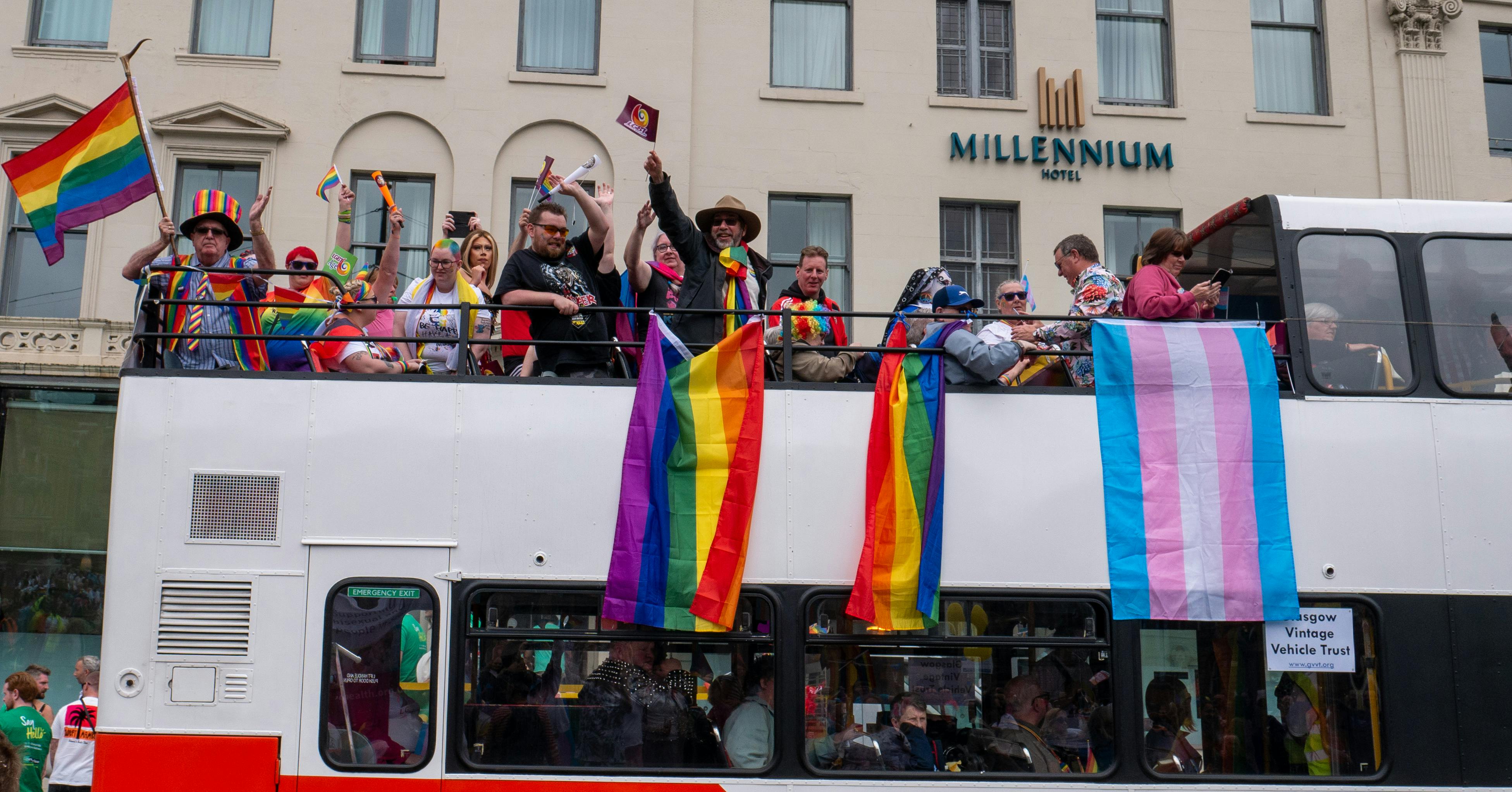 People Riding a Bus on a Parade · Free Stock Photo