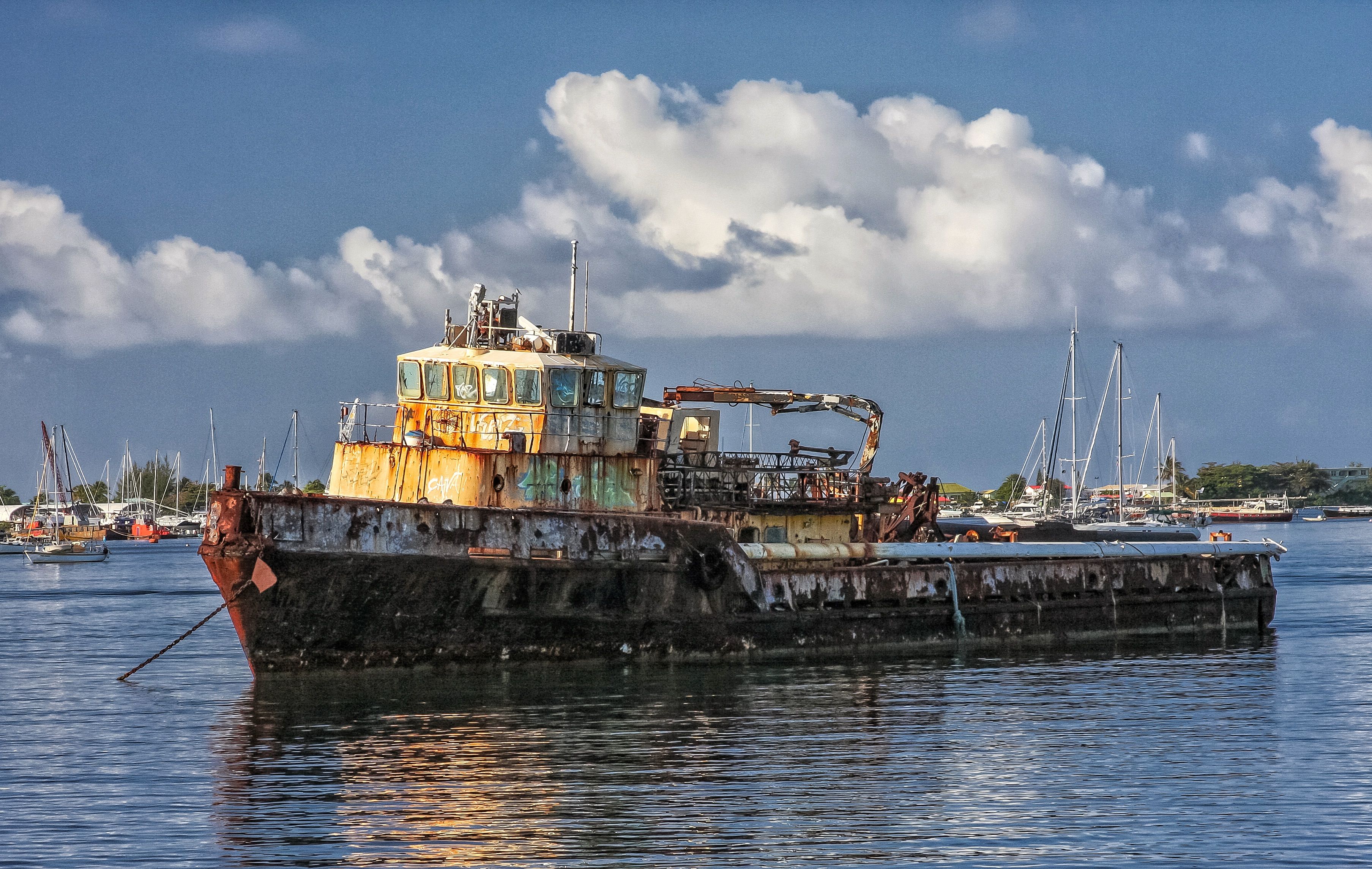 Rusty Abandoned Barge Floating on Water · Free Stock Photo