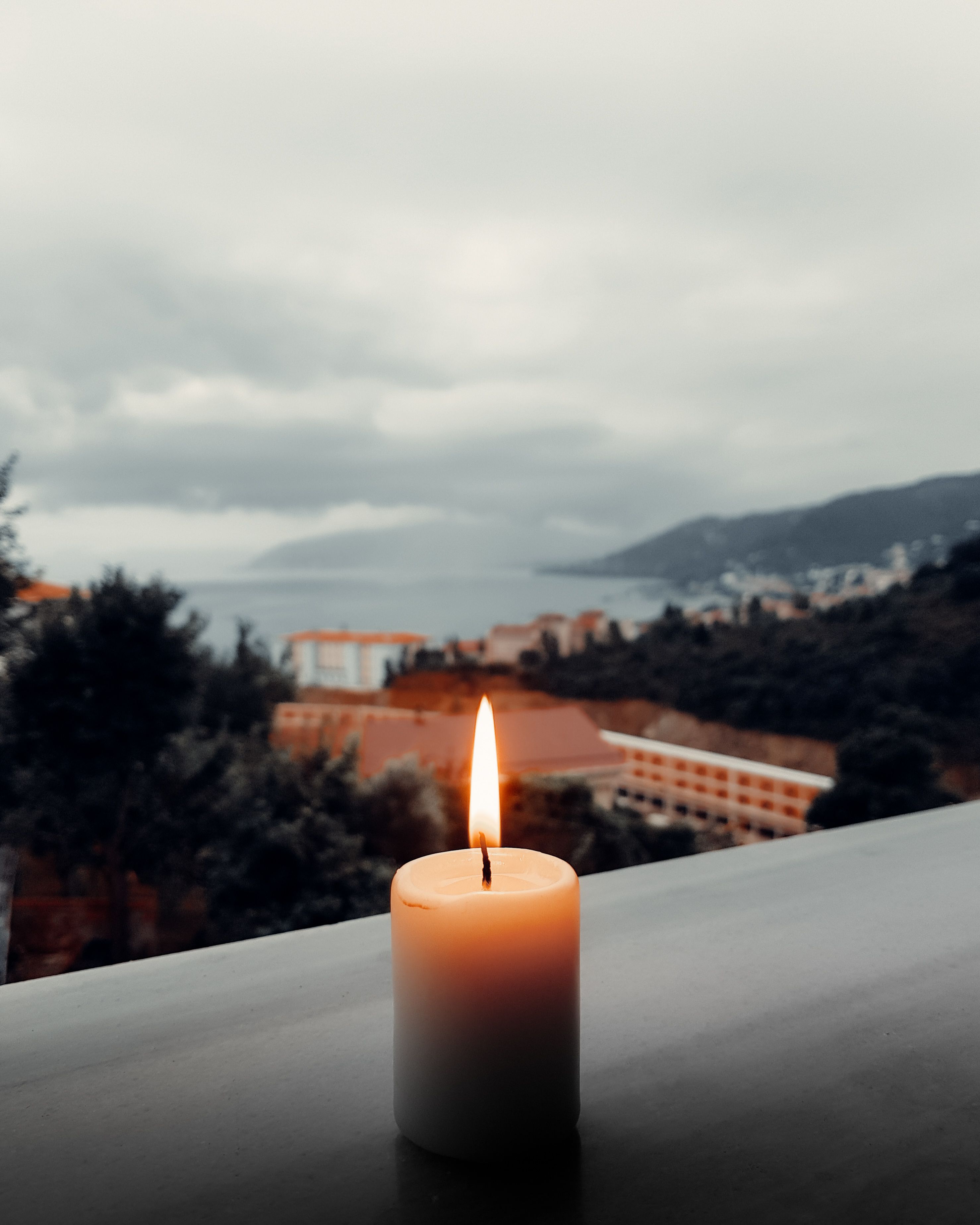 White Lighted Candle on White Surface · Free Stock Photo