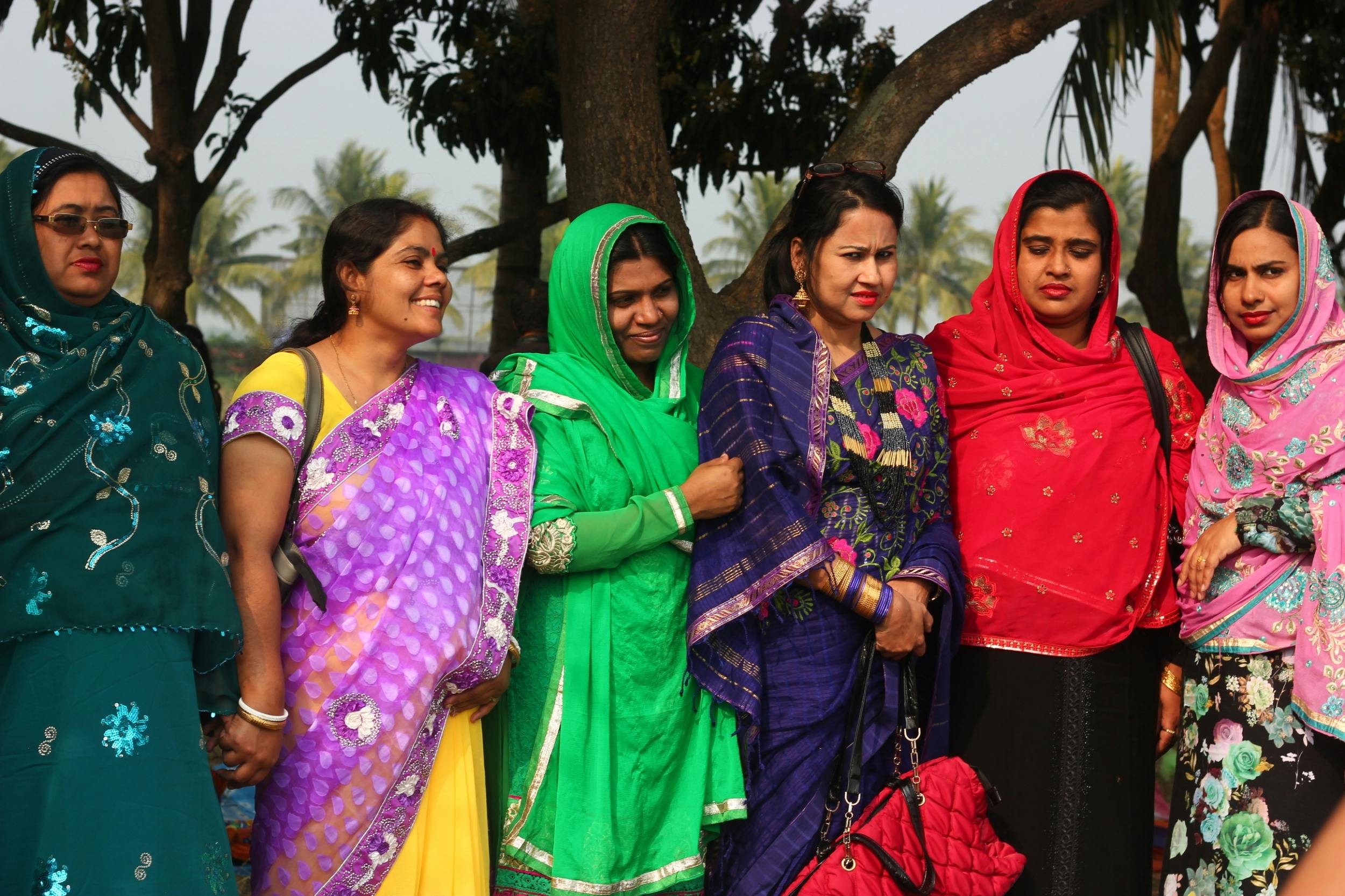 A Group of Photographers Walking on a Street · Free Stock Photo