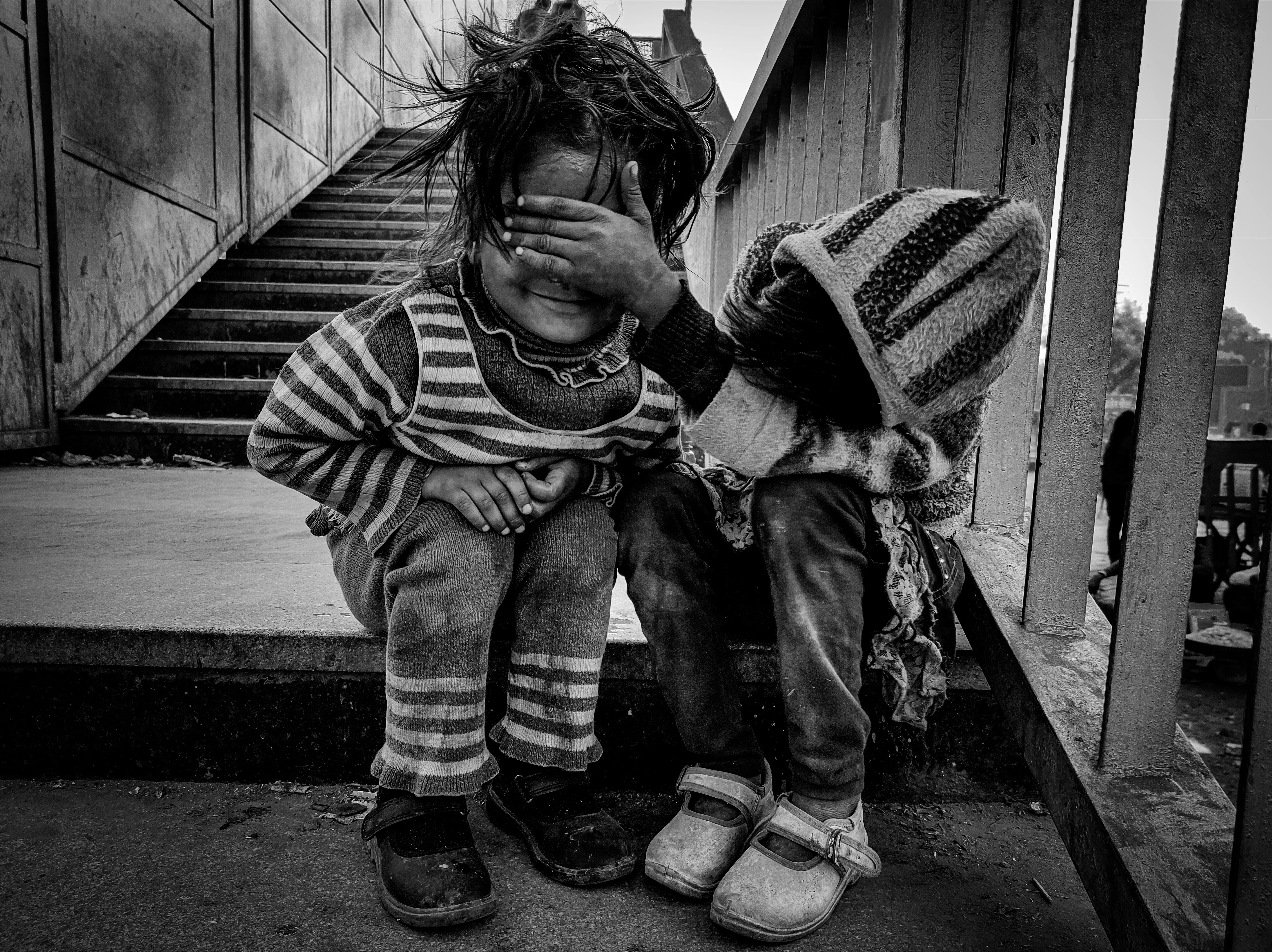 Poor Children Playing on Stairs on Street · Free Stock Photo