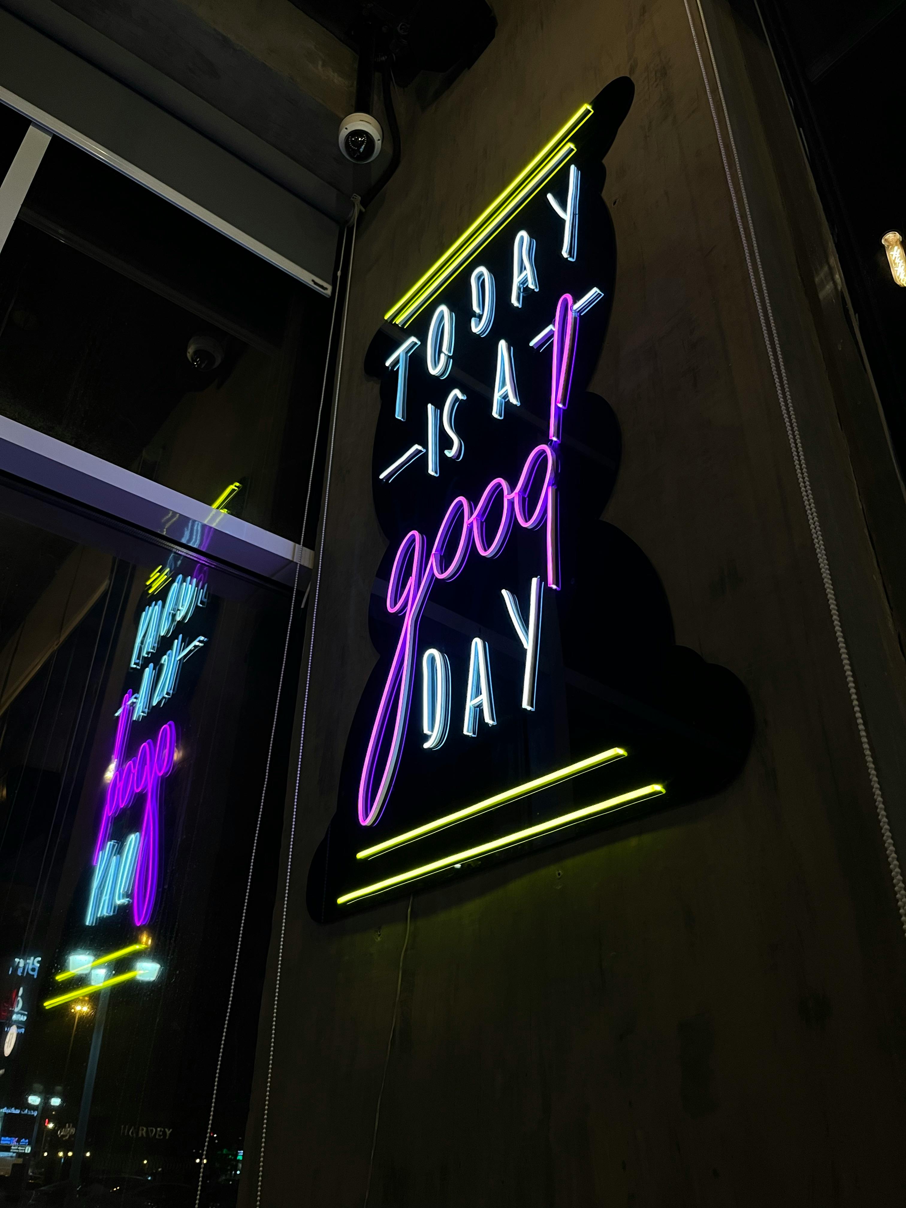 Neon Sign on Gray Wall · Free Stock Photo