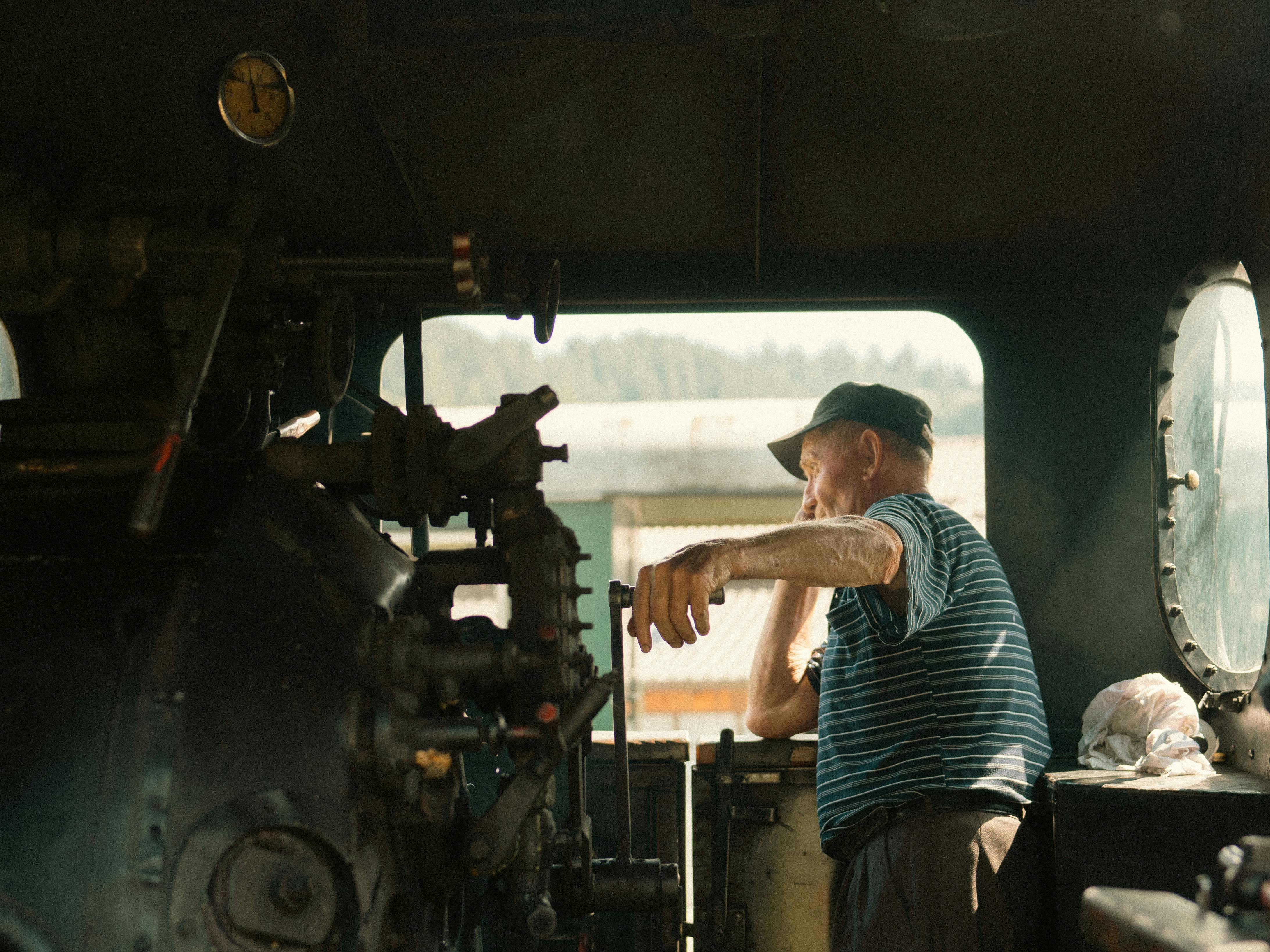 Man Operating Industrial Printer · Free Stock Photo