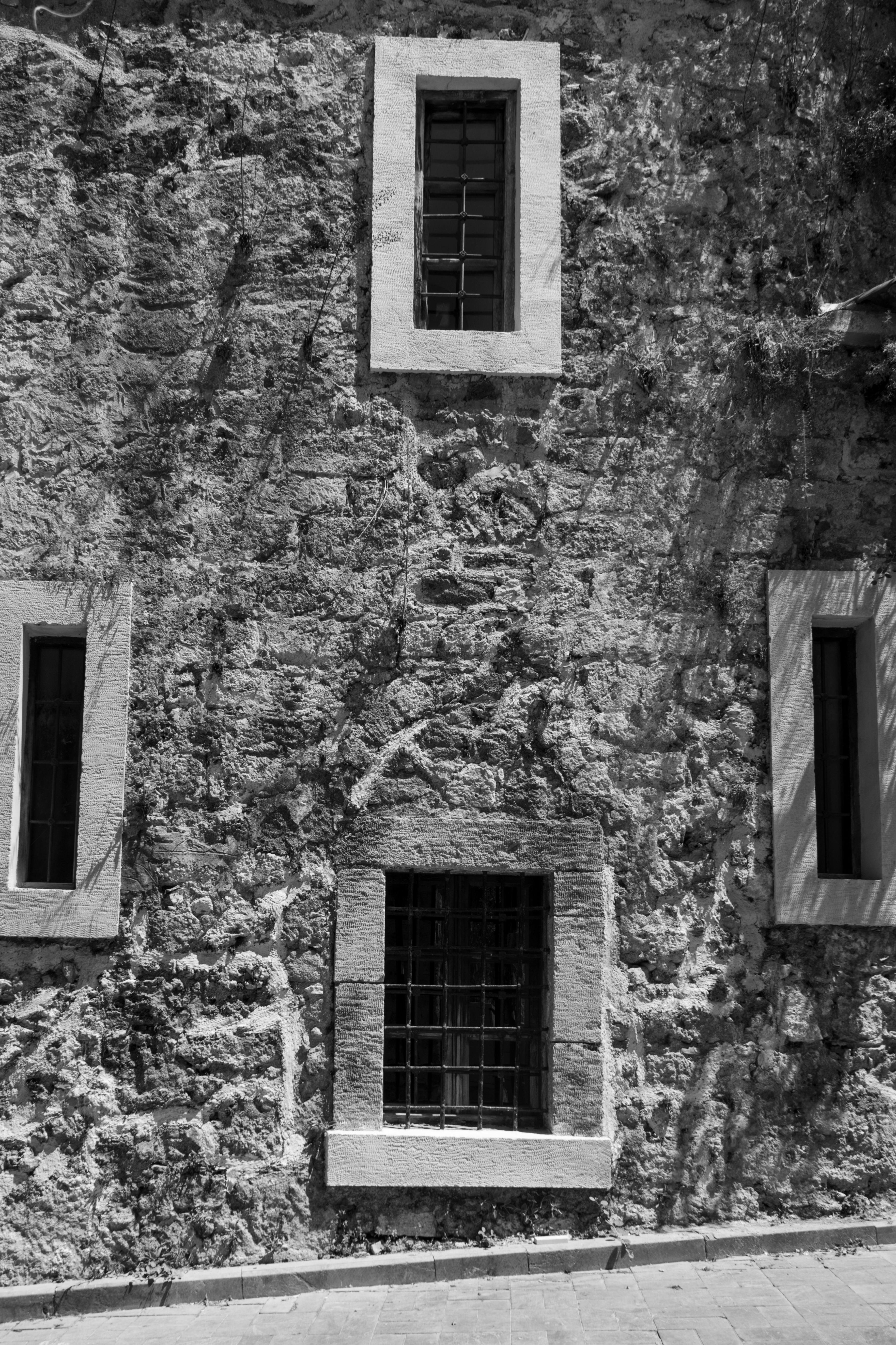 Metal Bars in Windows on Stone Wall · Free Stock Photo