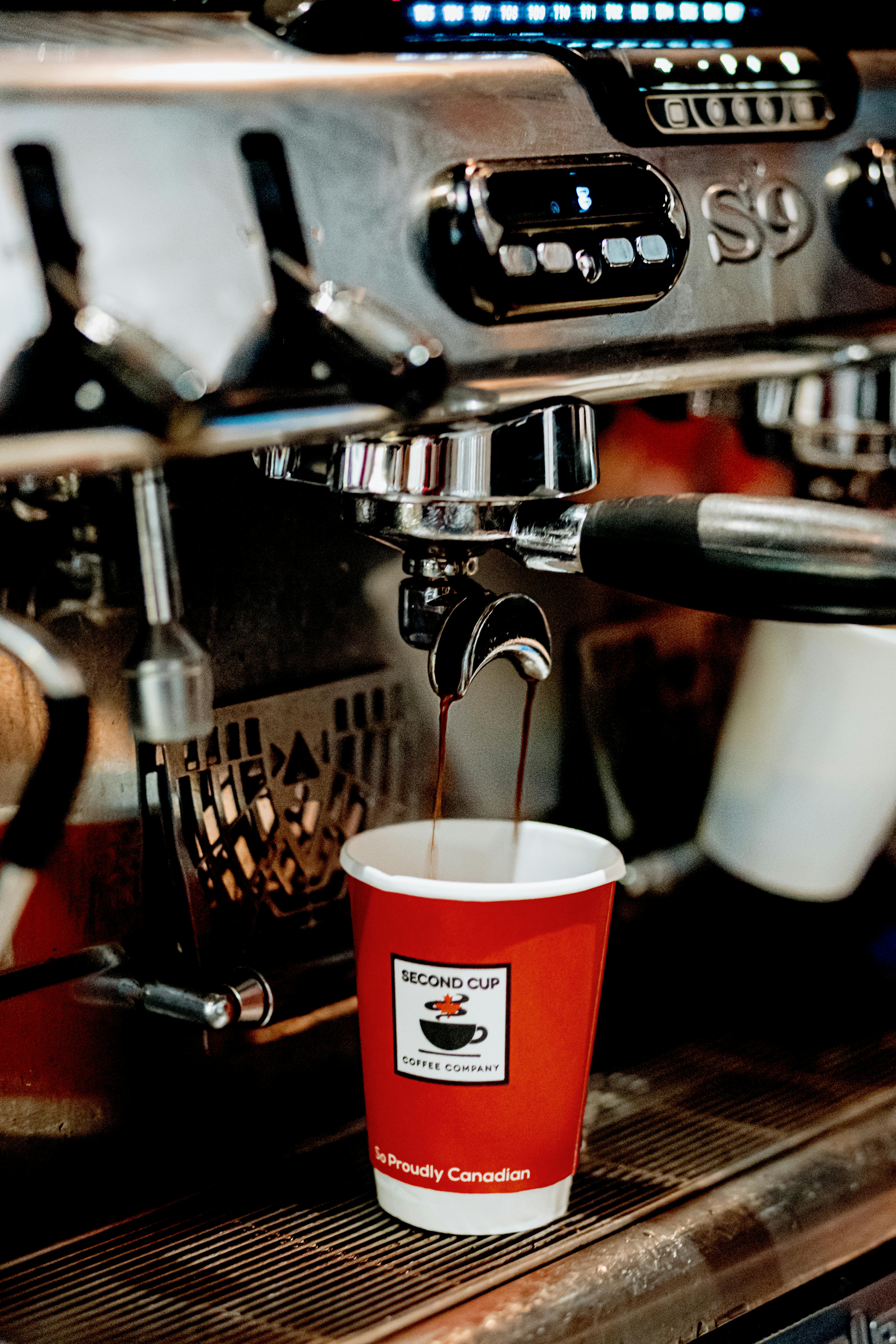 Coffee Flowing into a Disposable Cup from an Espresso Machine · Free ...