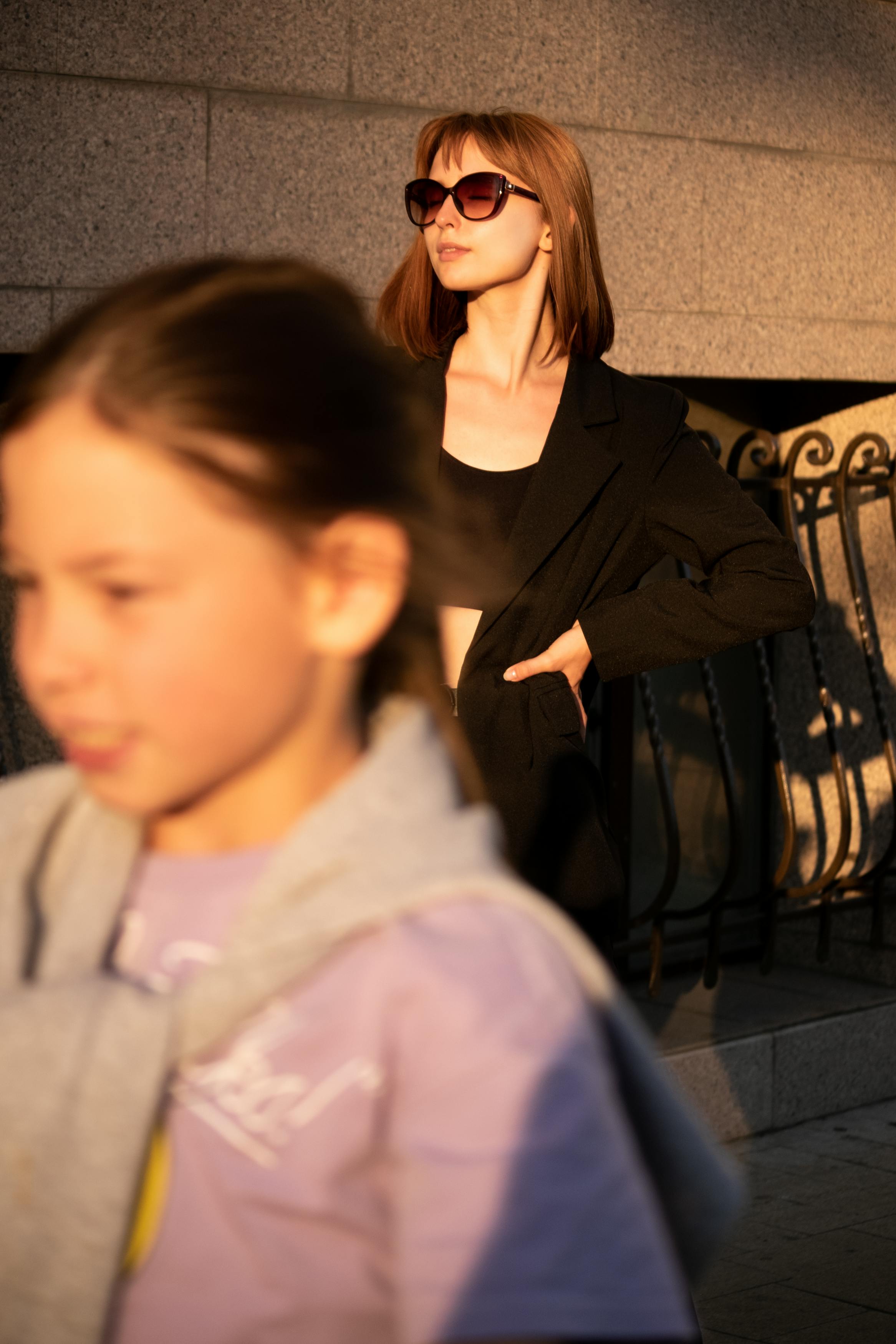 Brunette Woman Pointing at Window · Free Stock Photo