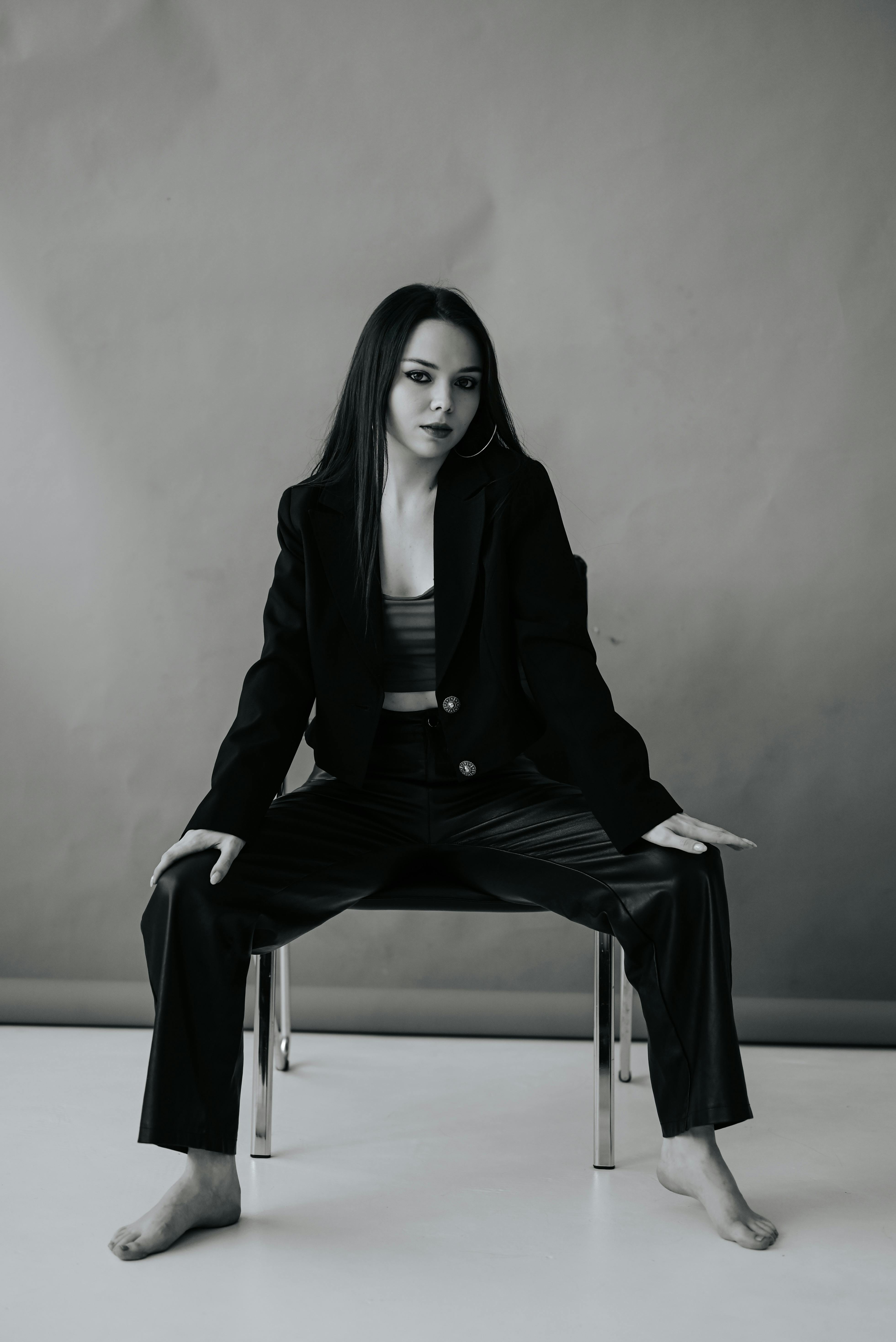Black and White Studio Photo of a Woman Sitting on a Chair Backwards ...