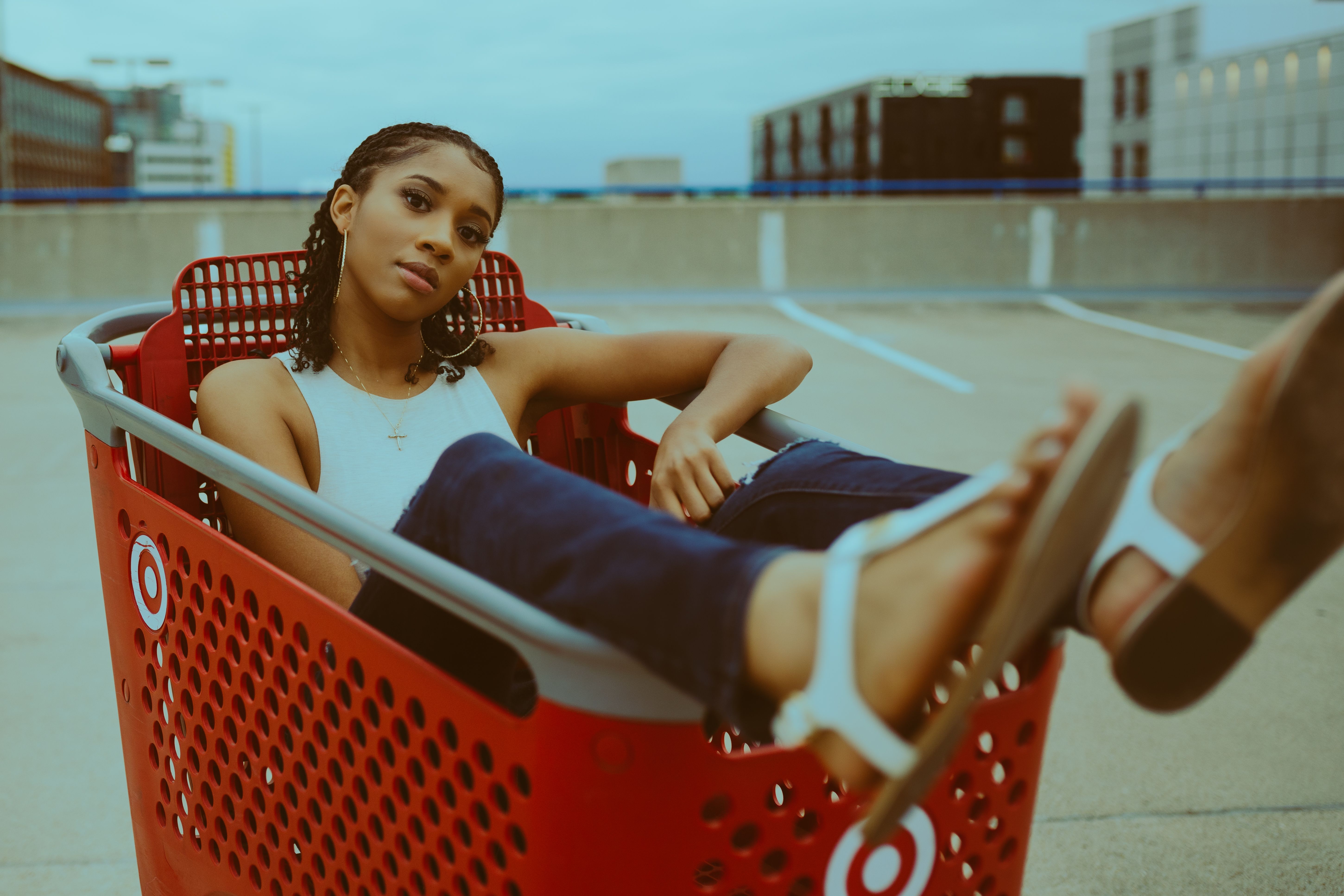 A Woman in White Tank Top and Blue Denim Jeans · Free Stock Photo