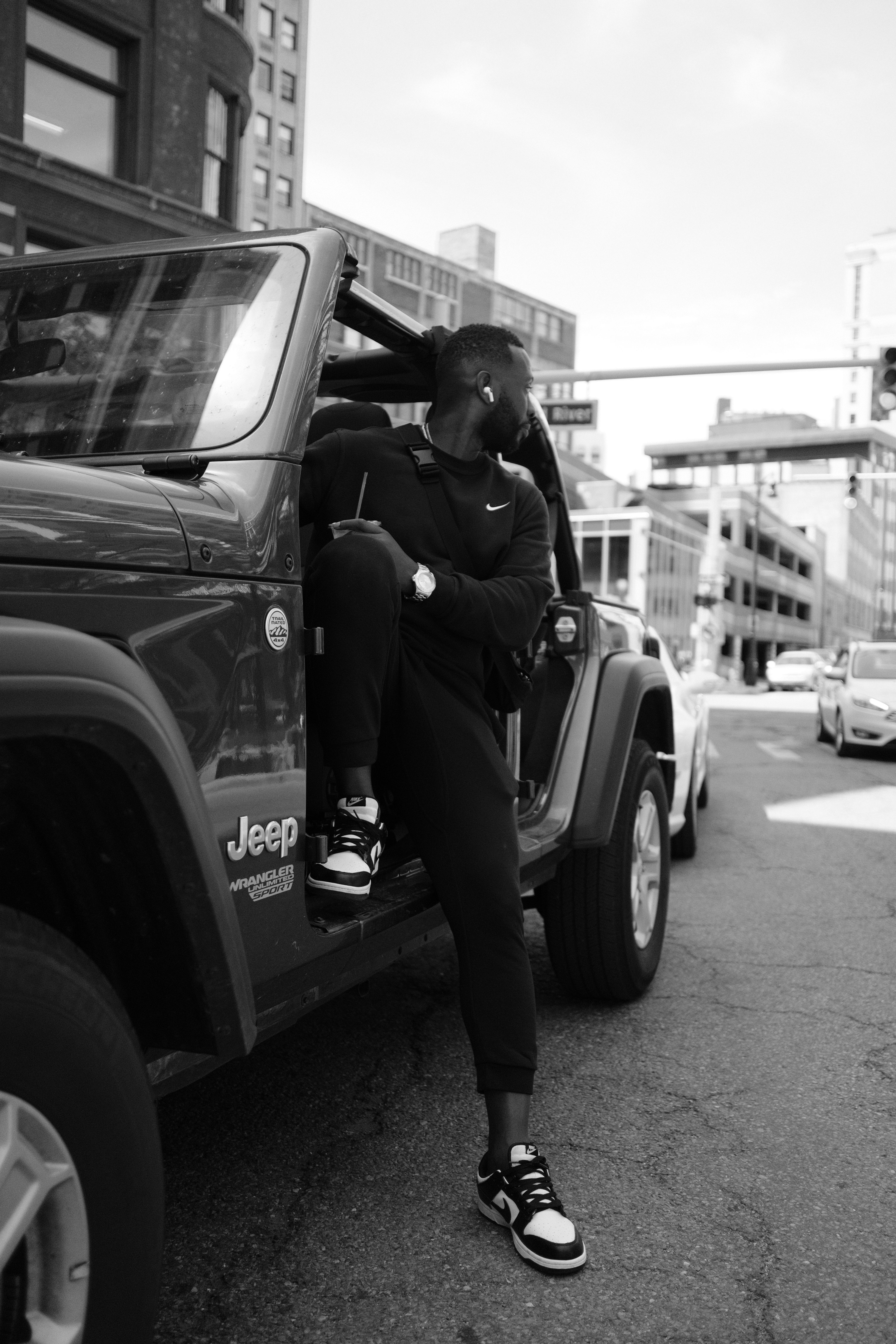 Man Sitting in Jeep Car on Street · Free Stock Photo