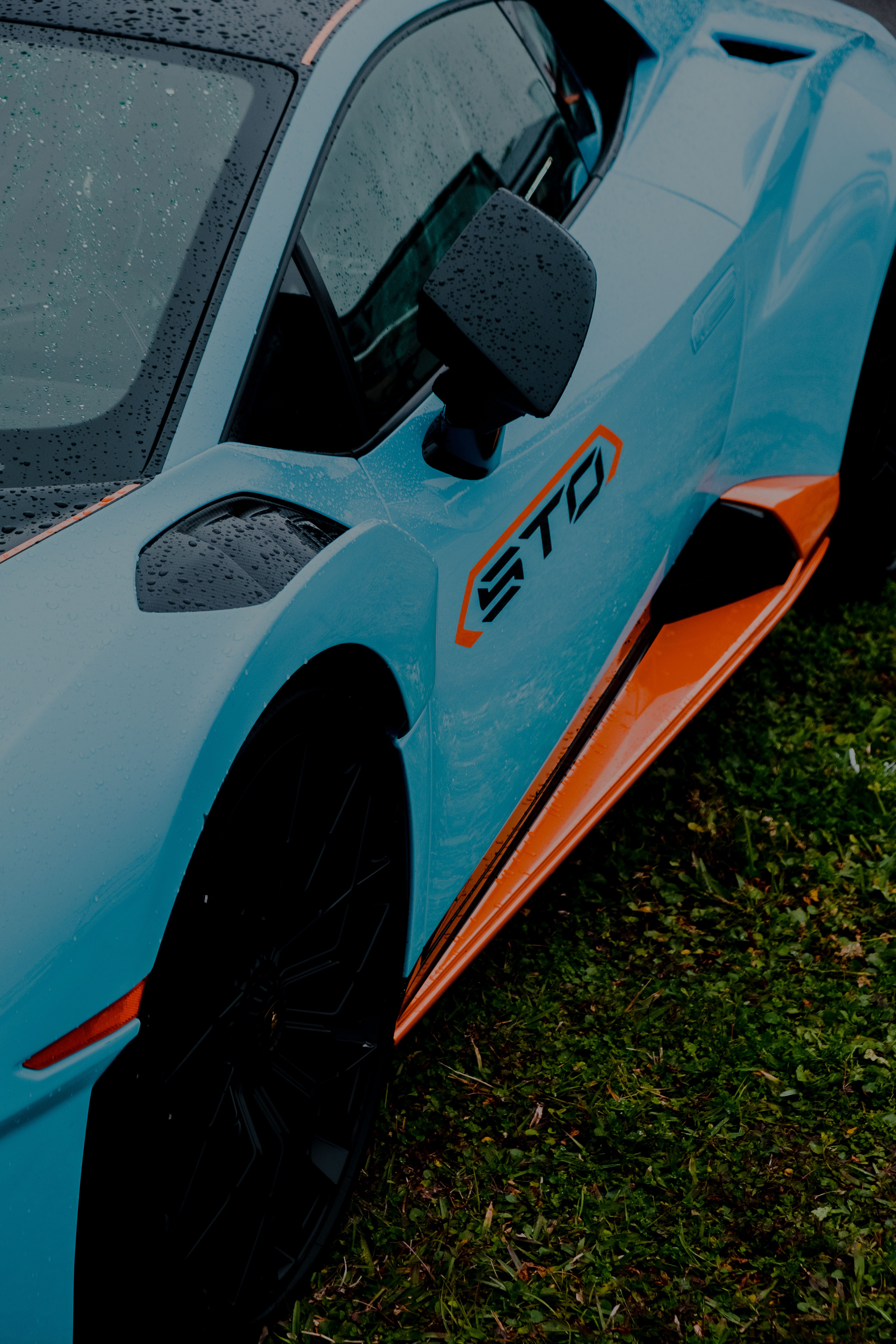 Blue Car Parked on Green Field in Close-up Photography · Free Stock Photo