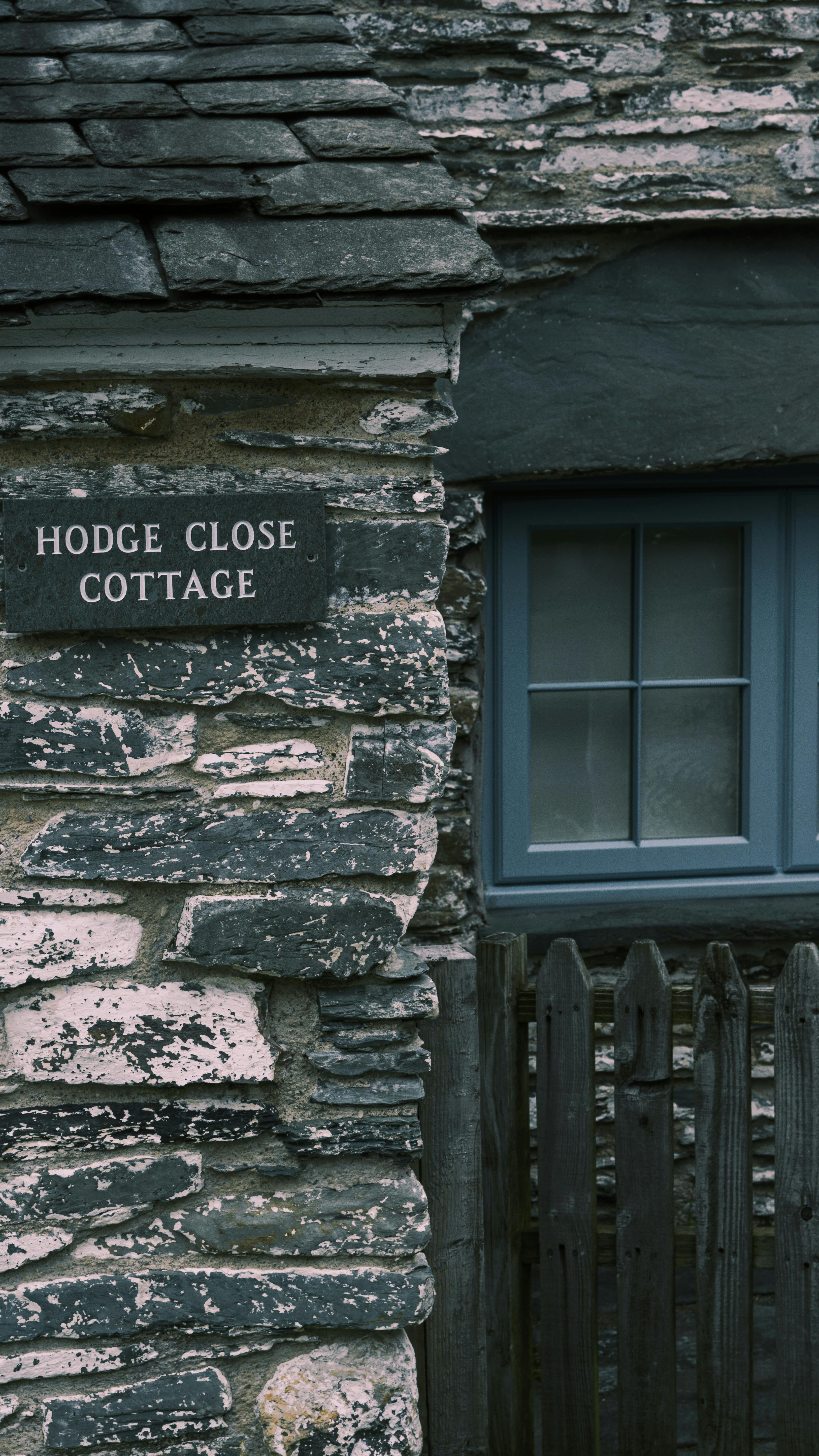 Signage on Stone Wall · Free Stock Photo