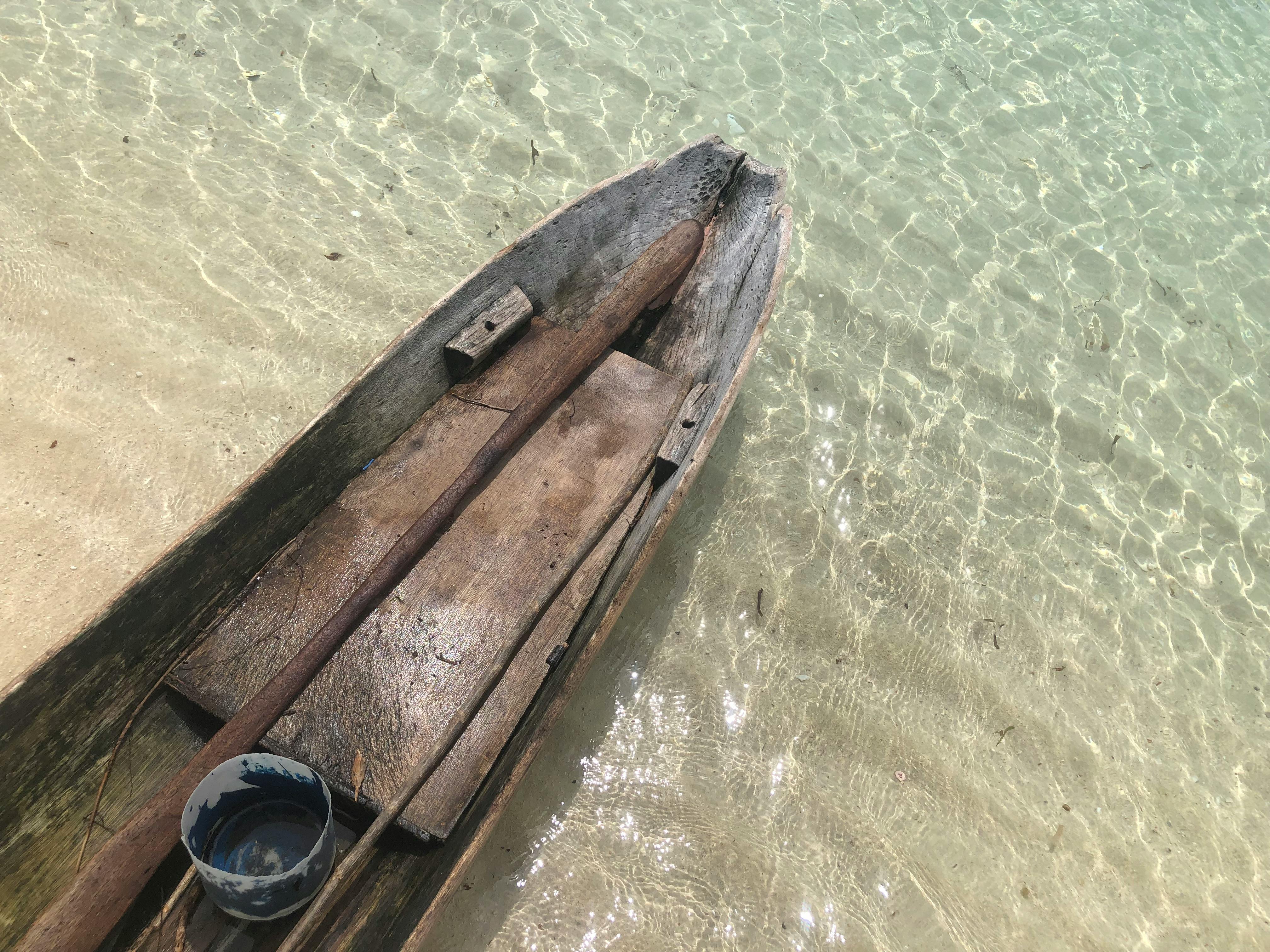 Brown Wooden Boat on Body of Water · Free Stock Photo