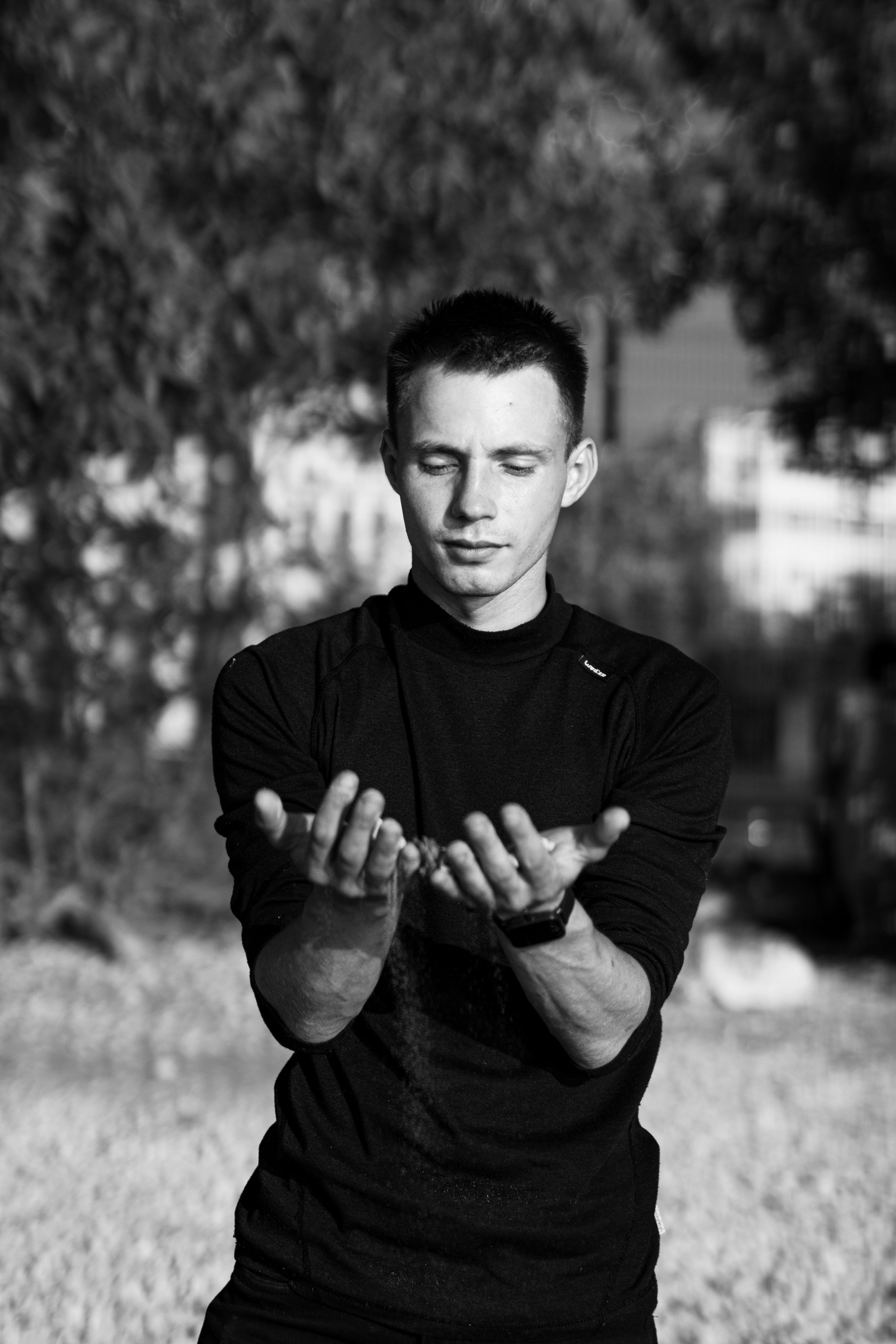 Standing Man Looking at Hands · Free Stock Photo