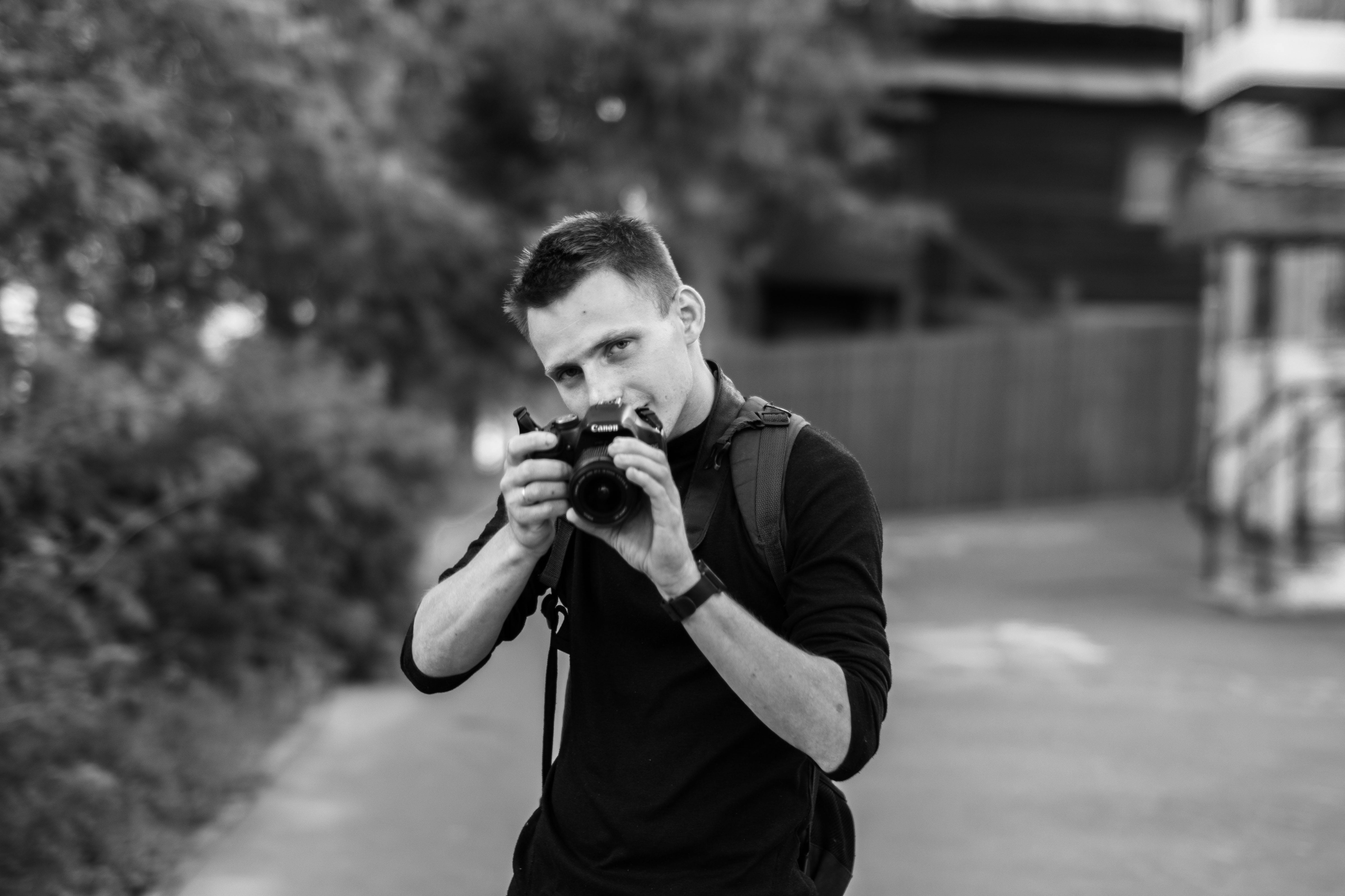 Black and White Photo of Strongman Smashing Bricks · Free Stock Photo