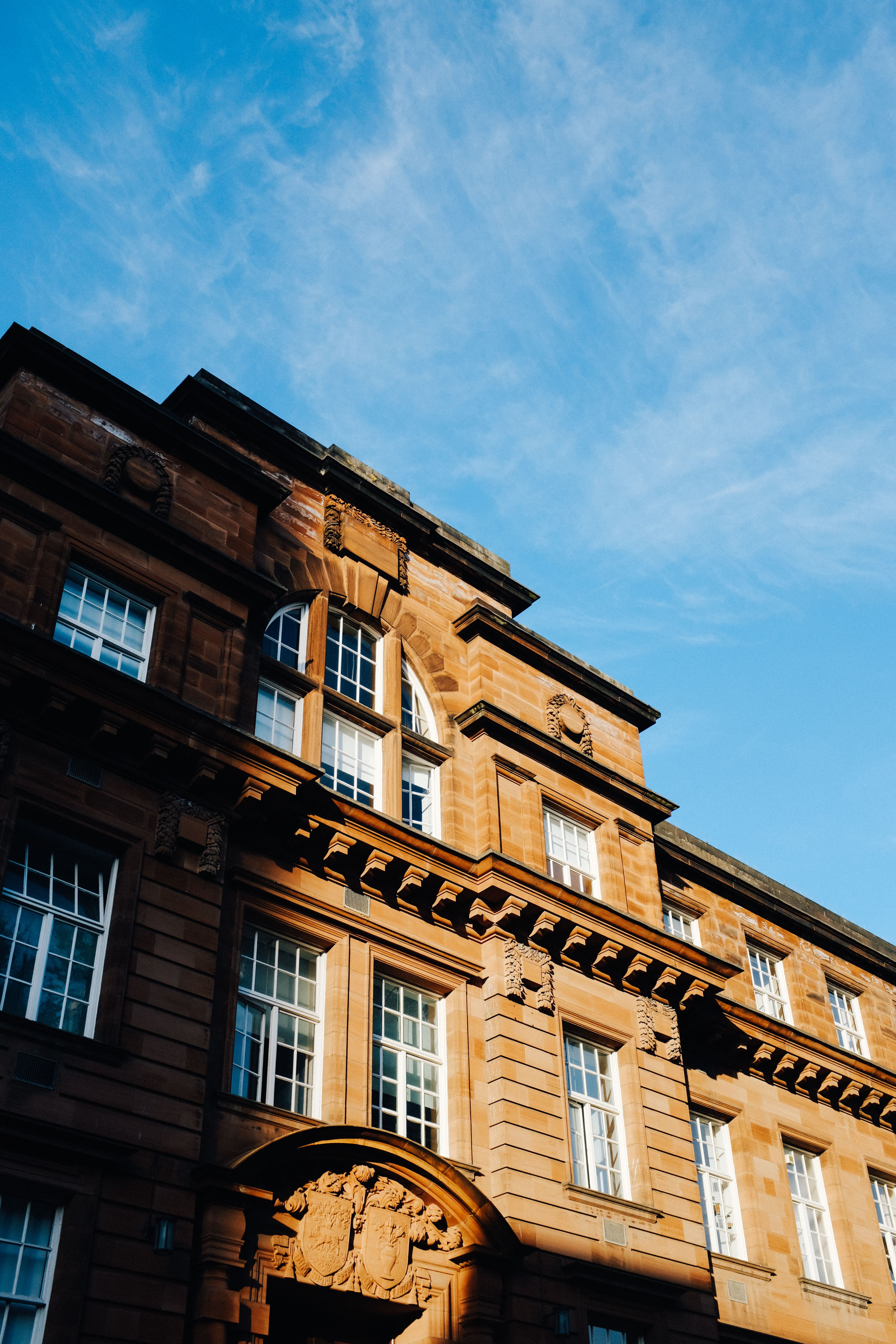 Brown Concrete Building Under Blue Sky · Free Stock Photo