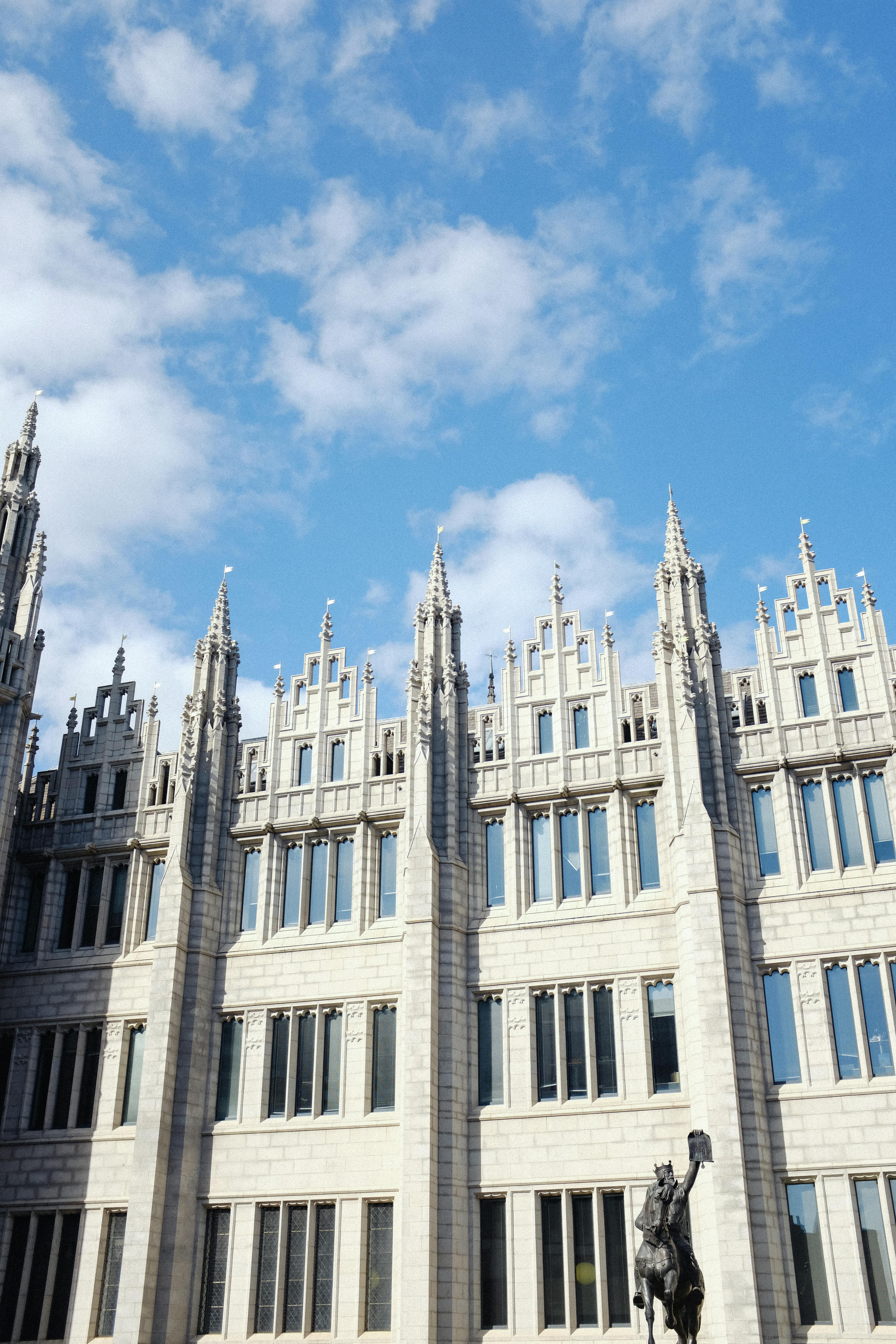 White Granite Building Under Blue Sky · Free Stock Photo