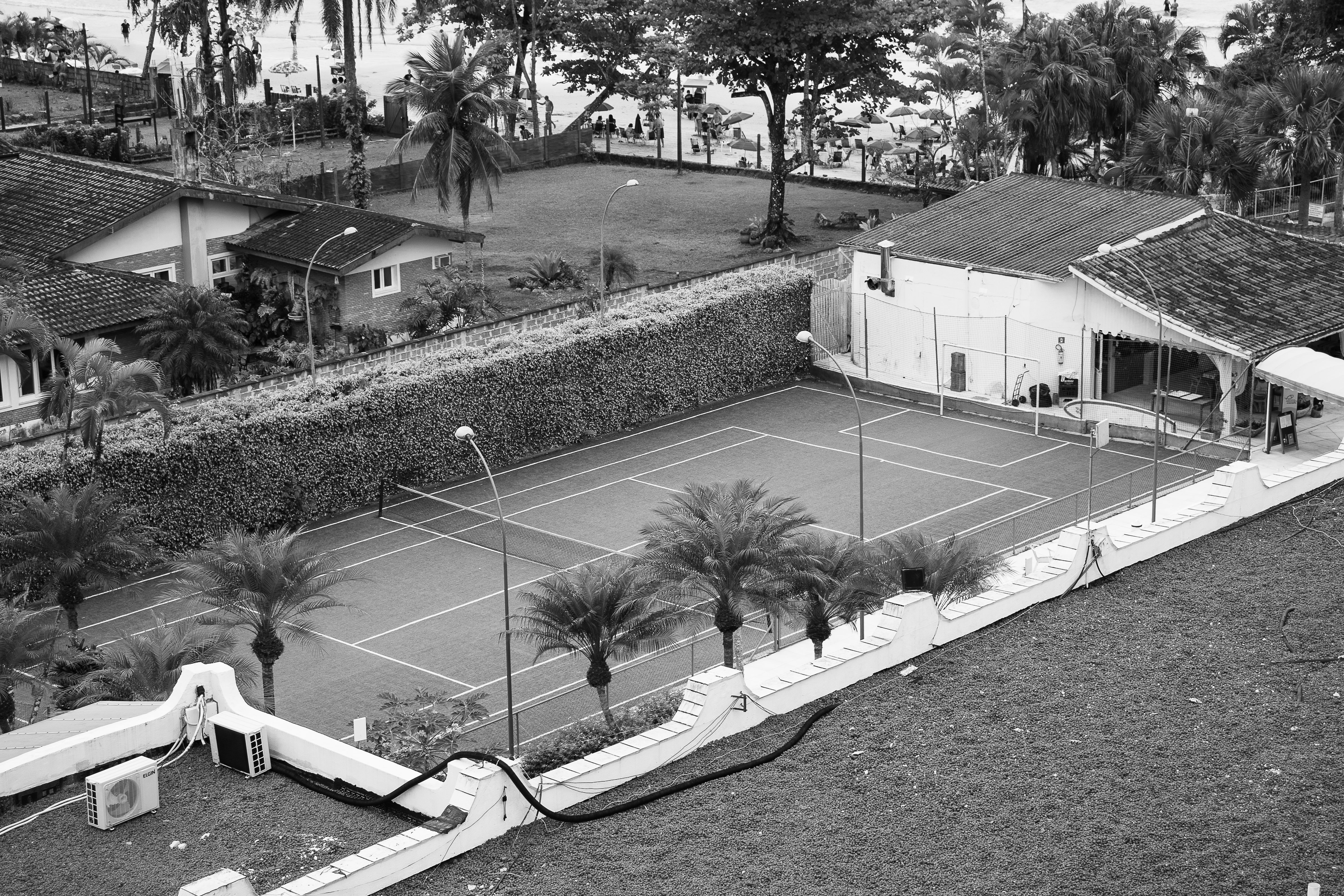 Grayscale Photo of a Tennis Court · Free Stock Photo