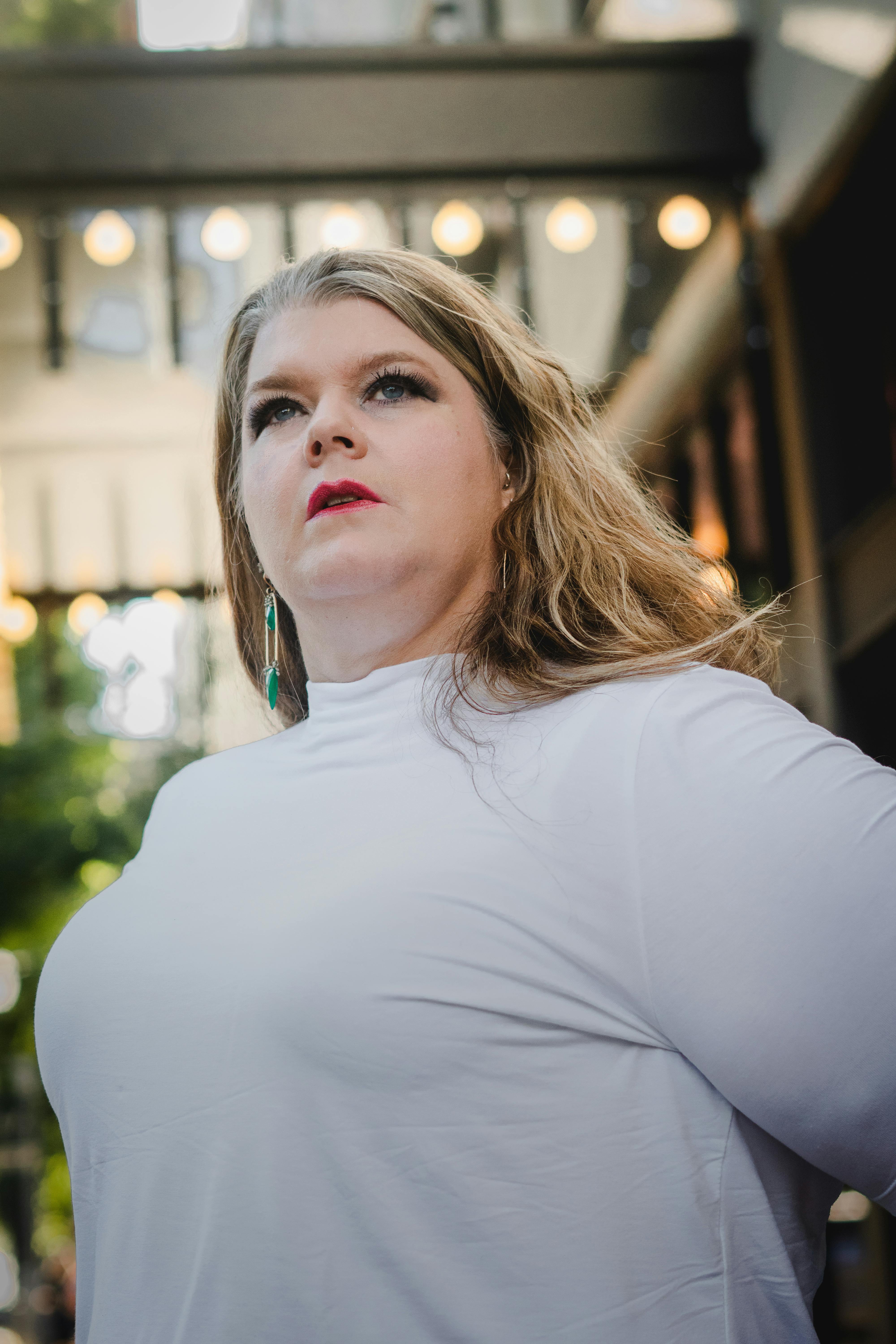 A Woman in White Crew Neck Long Sleeve Shirt · Free Stock Photo