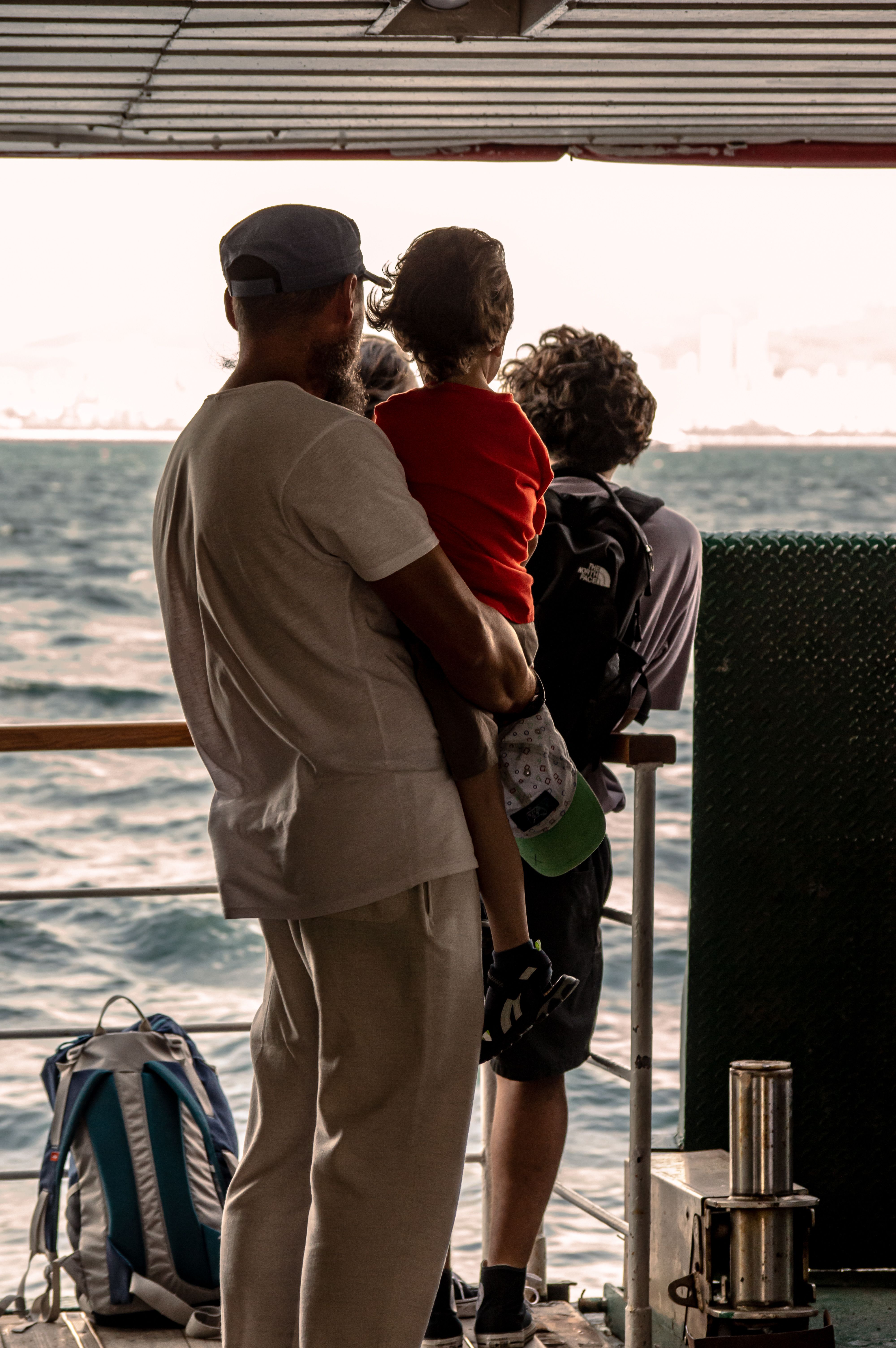 A Man Carrying His Child · Free Stock Photo