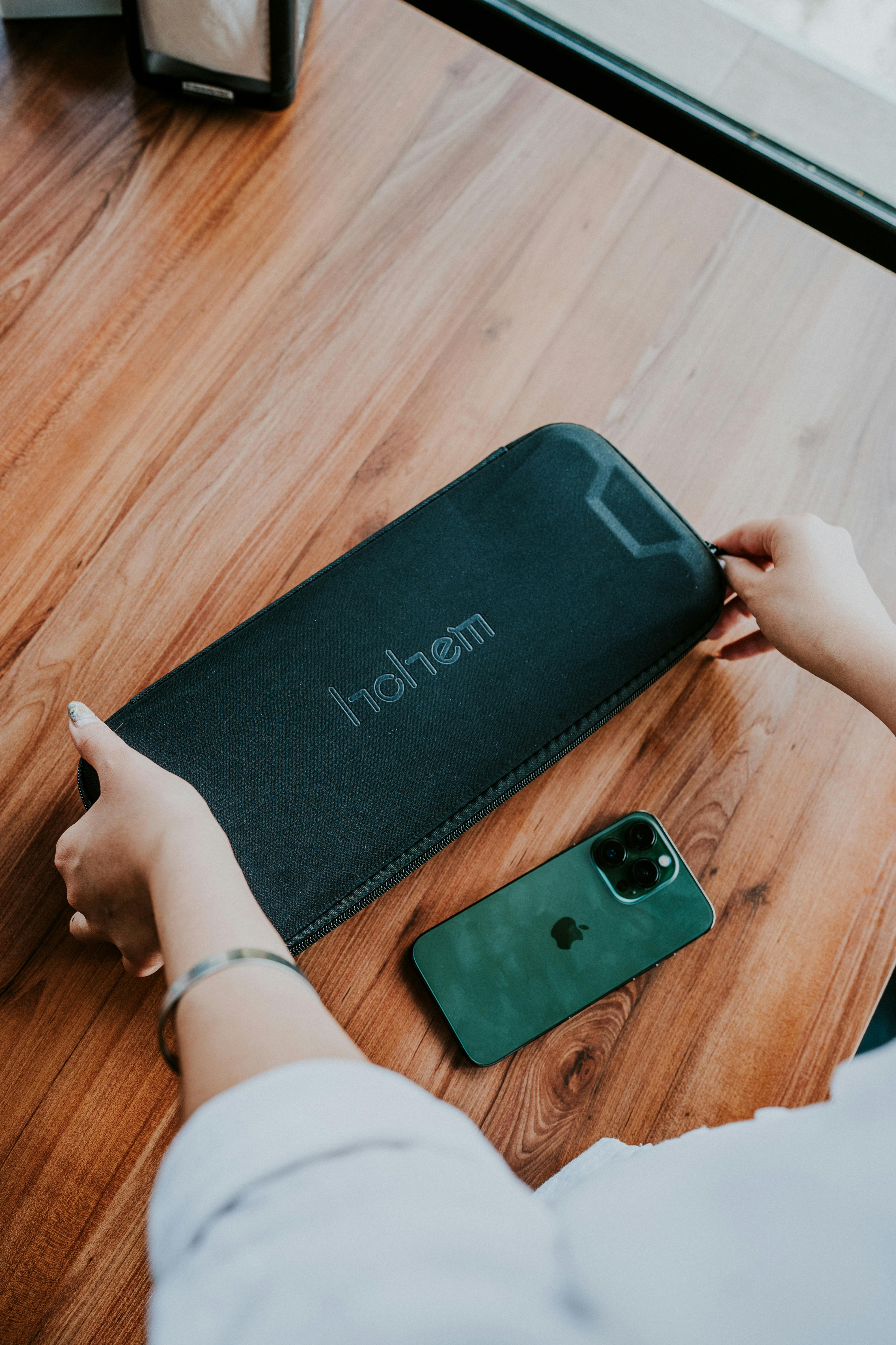 Close-Up Shot of a Person Holding a Smartphone Updating · Free Stock Photo