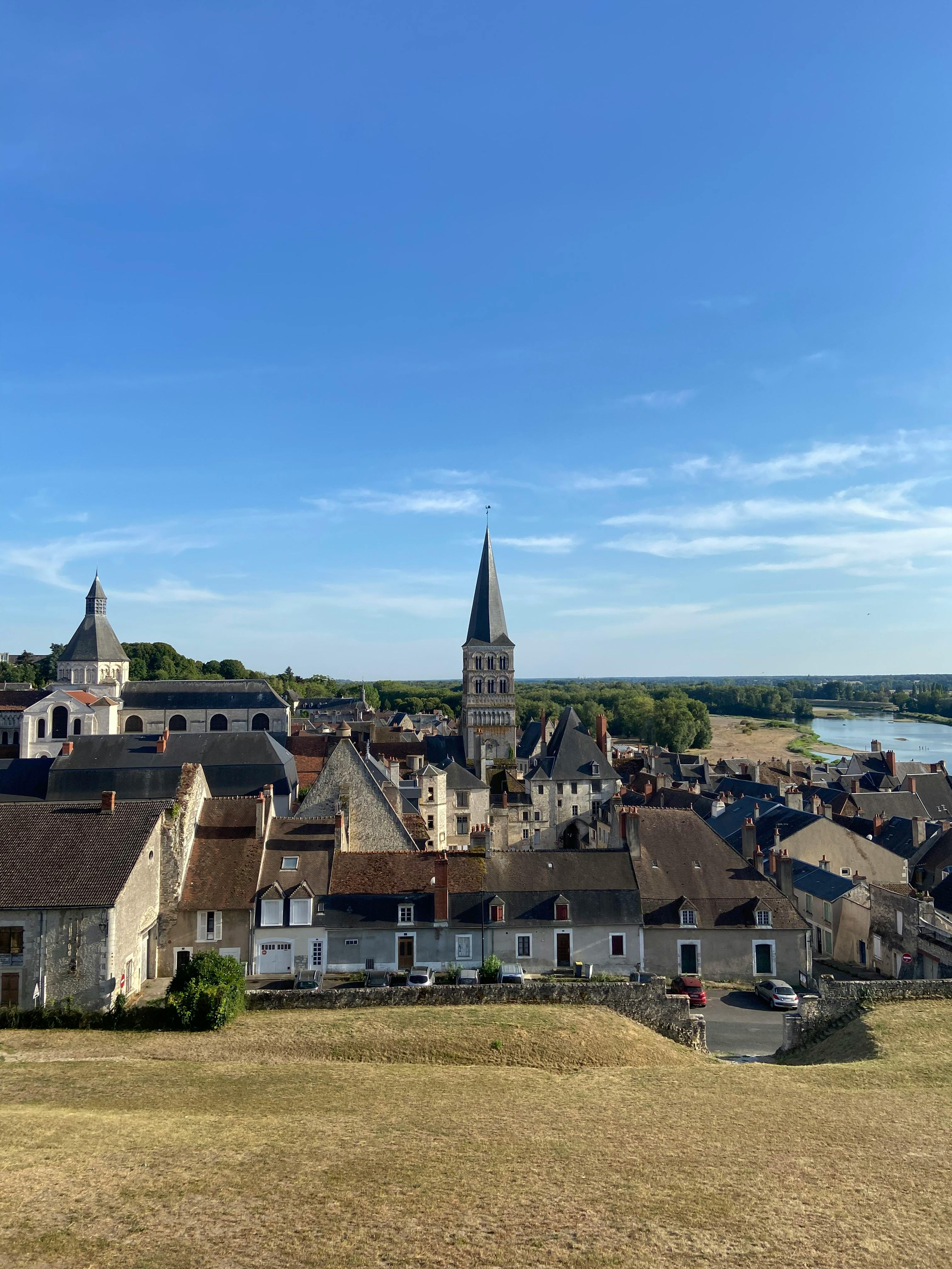 Countryside with a Village and Spiky Tower · Free Stock Photo