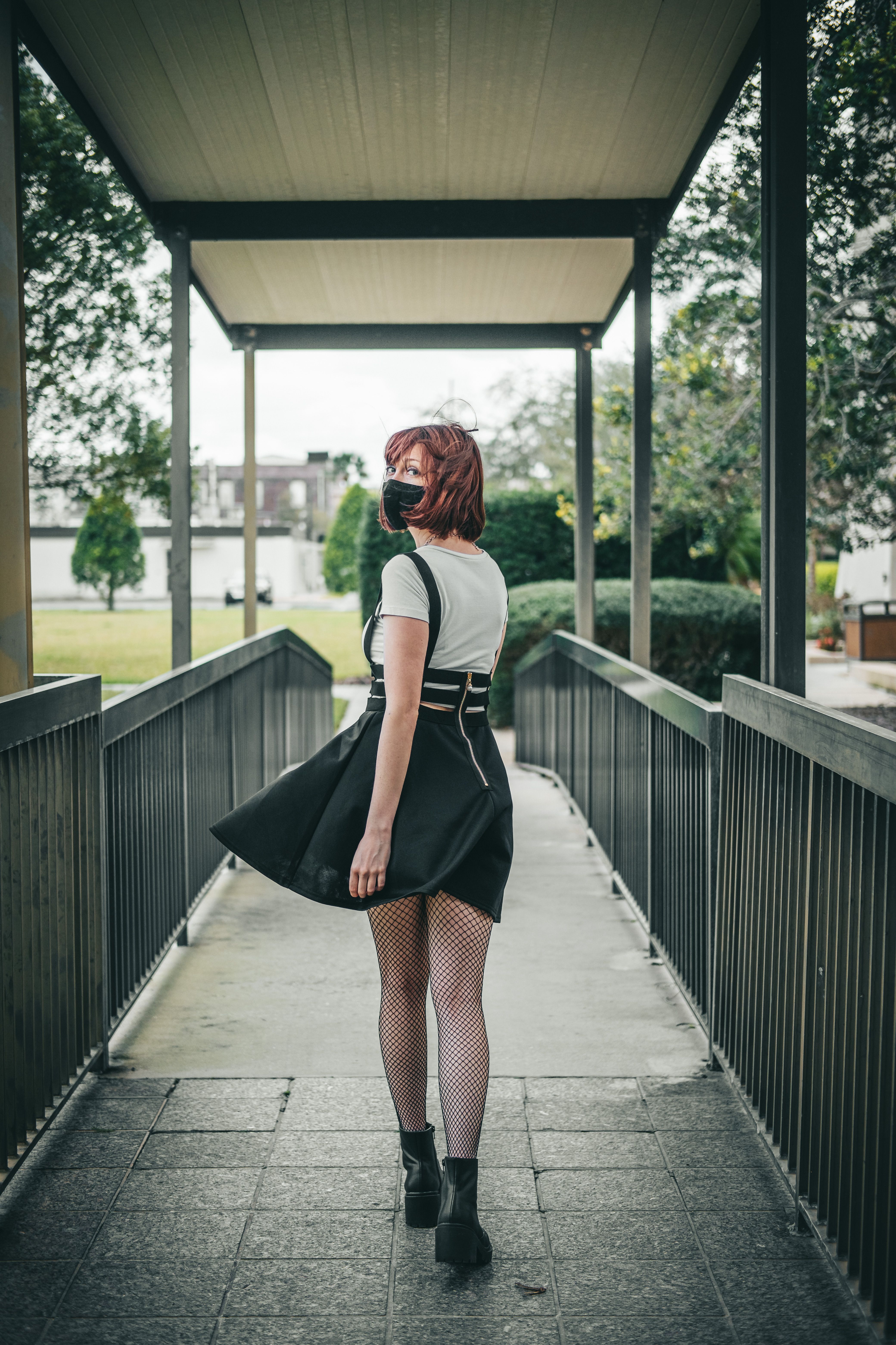 Woman in Face Mask Walking on Bridge · Free Stock Photo