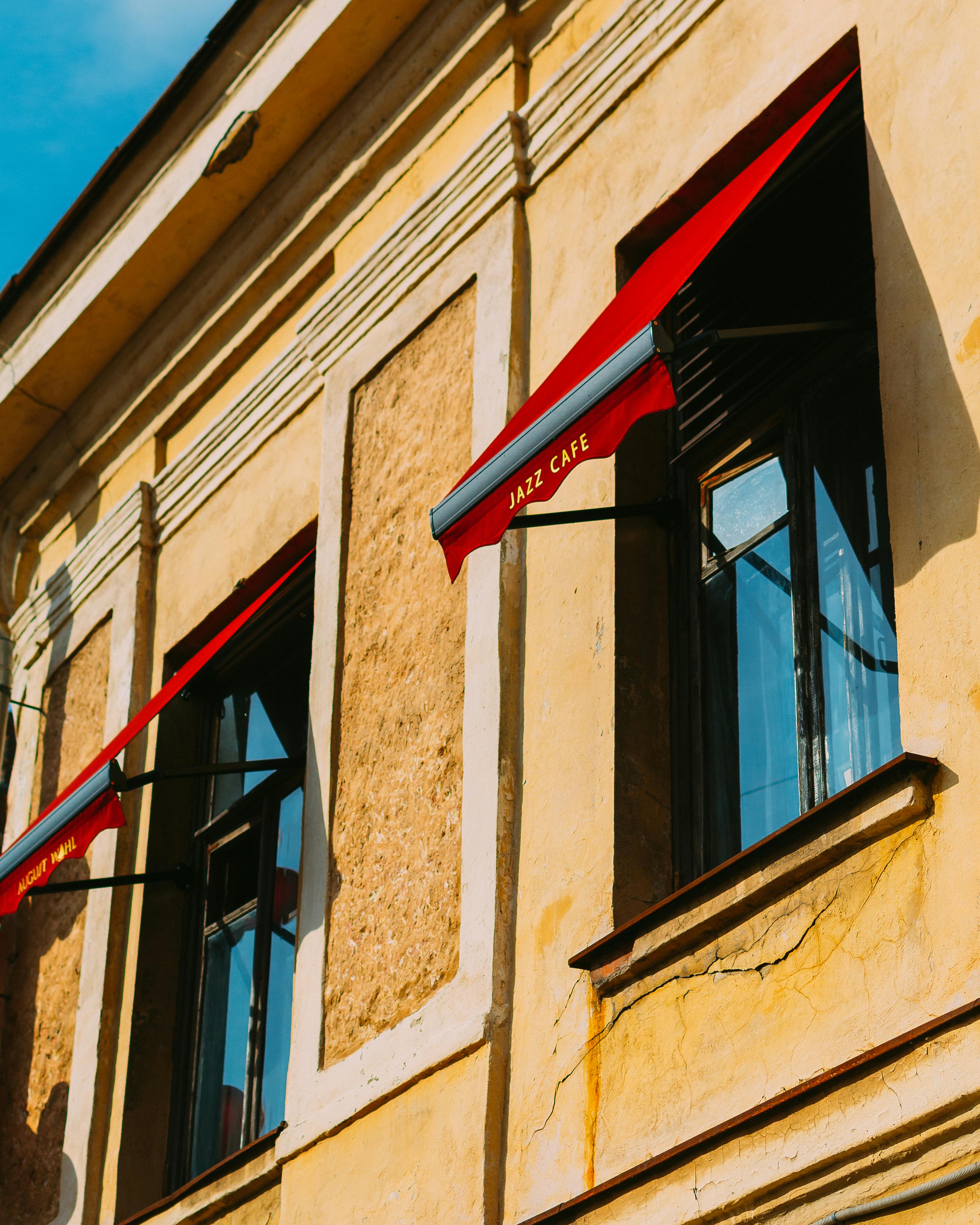 Concrete Wall with Shaded Windows · Free Stock Photo