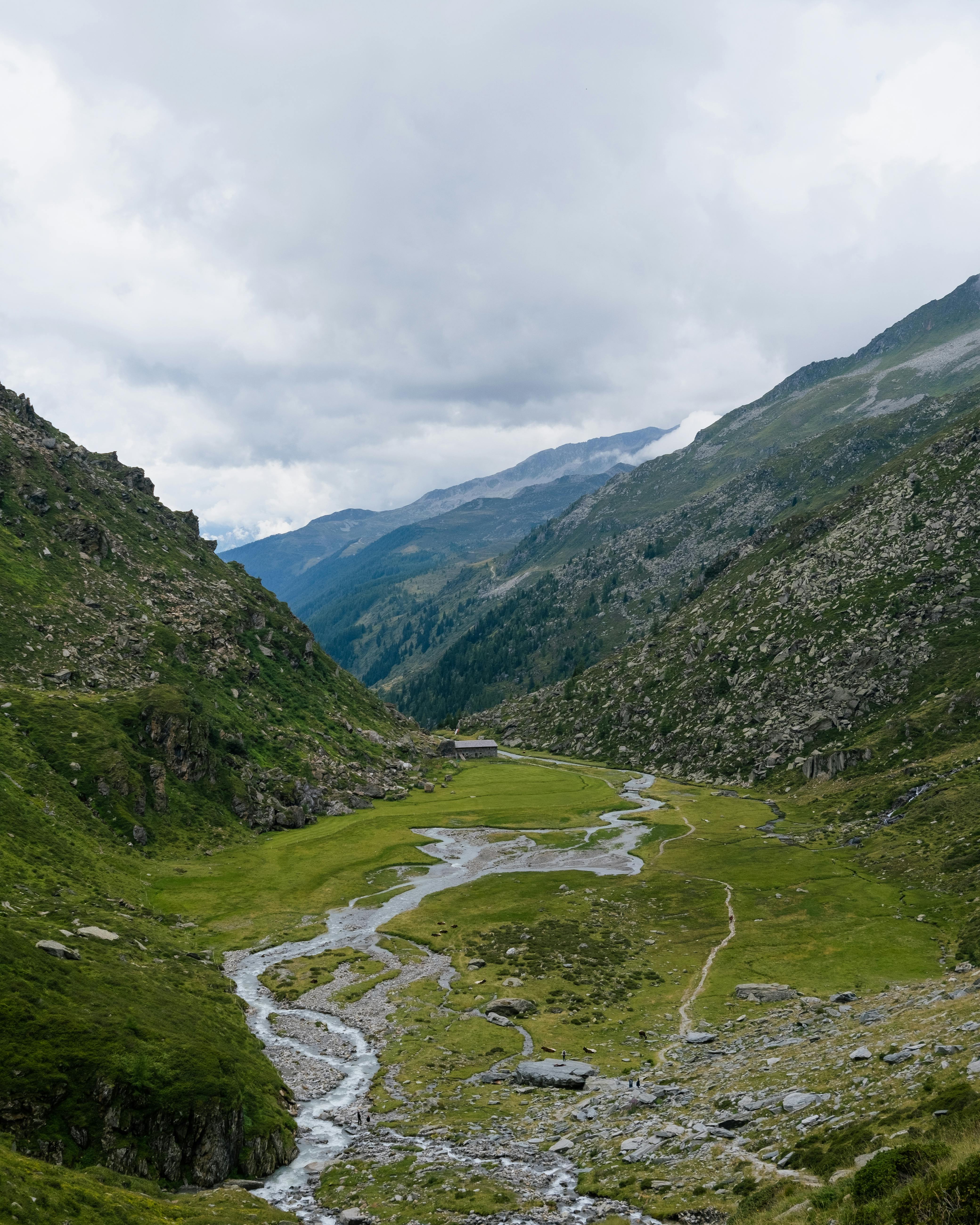 Aerial View of River in Between Green Mountains · Free Stock Photo