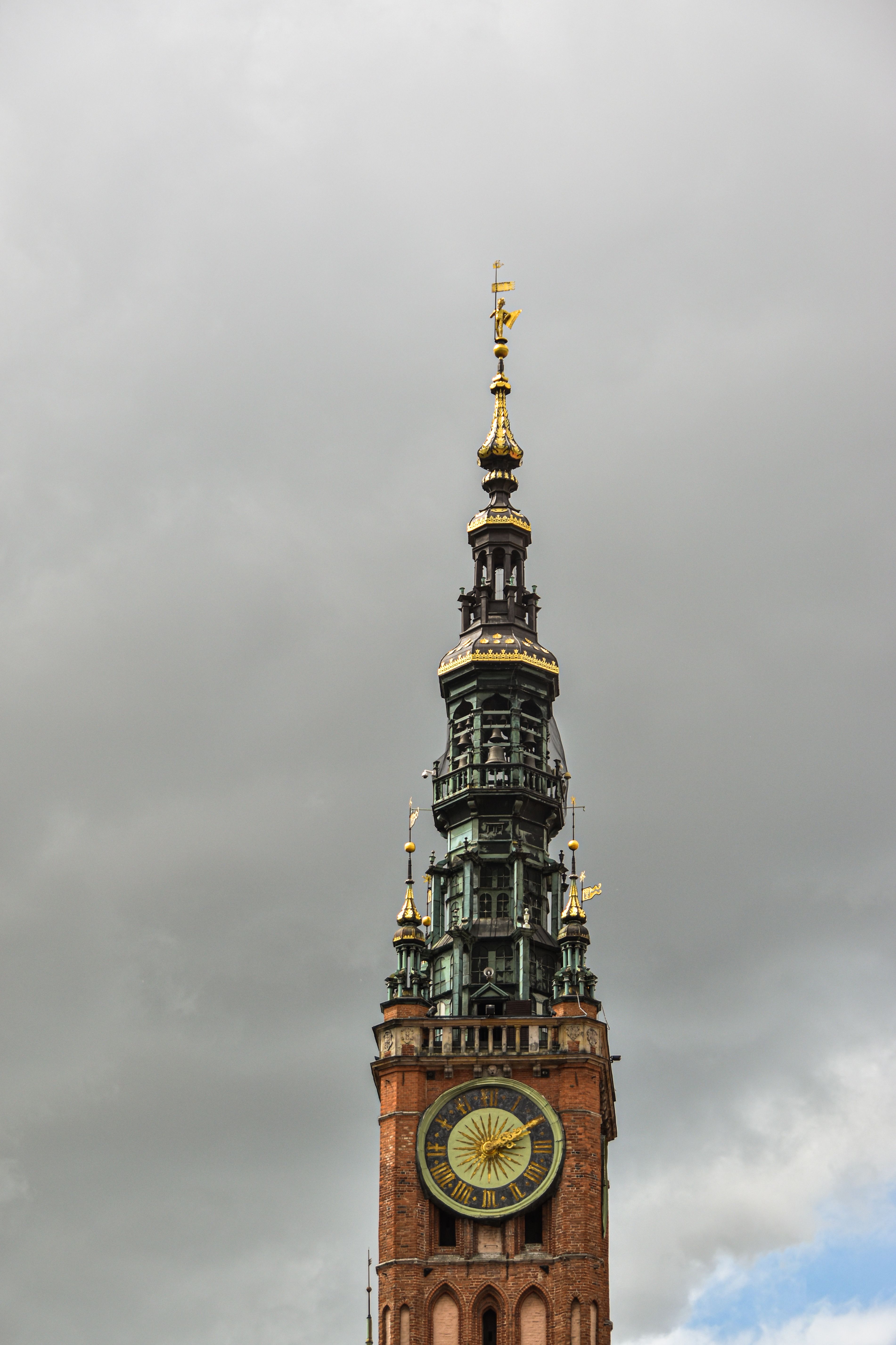 Brown and Black Clock Tower Under Cloudy Sky · Free Stock Photo