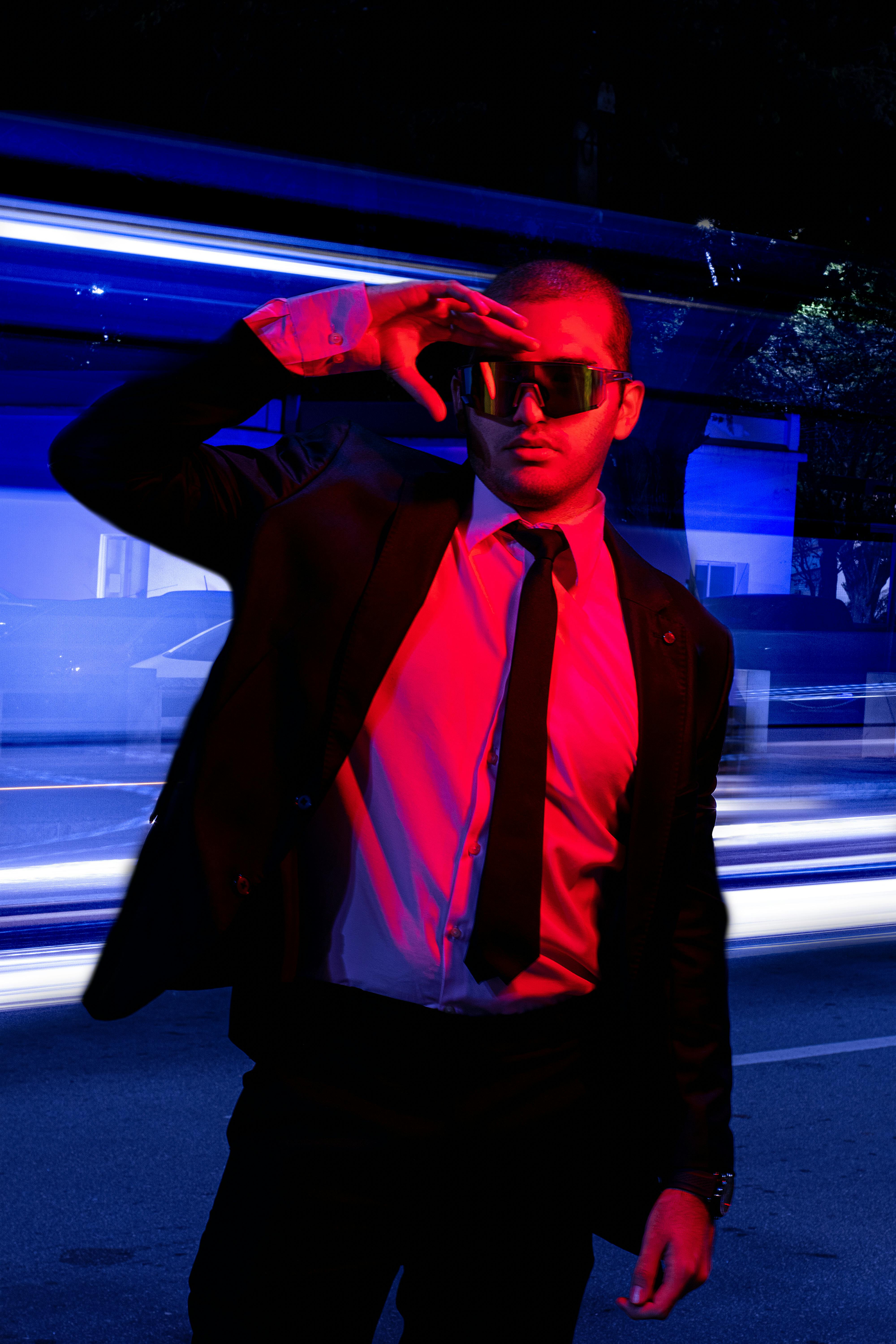 Man Looking Afar Wearing Sunglasses Posing in Black Suit · Free Stock Photo
