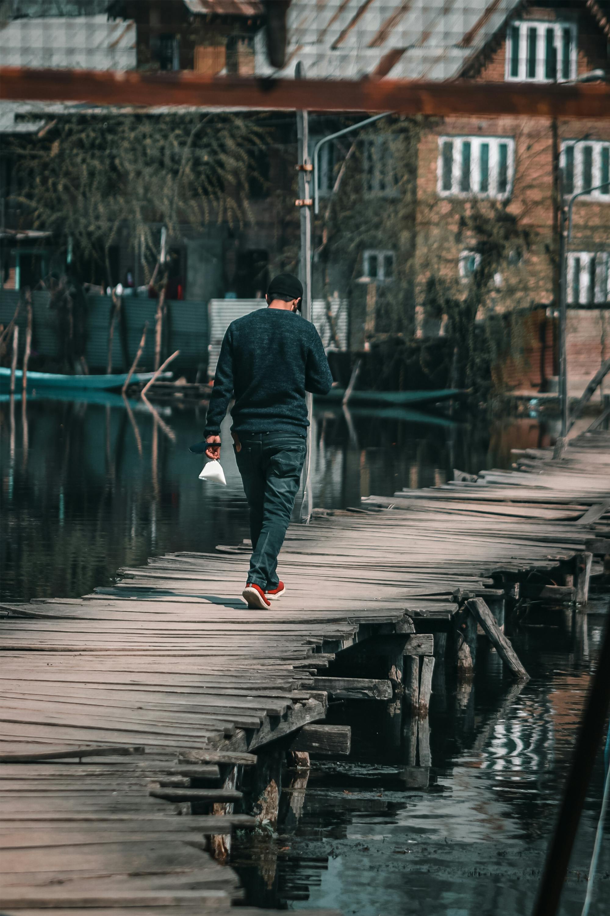 Back View of a Person with an Umbrella Walking in the Rain · Free Stock ...