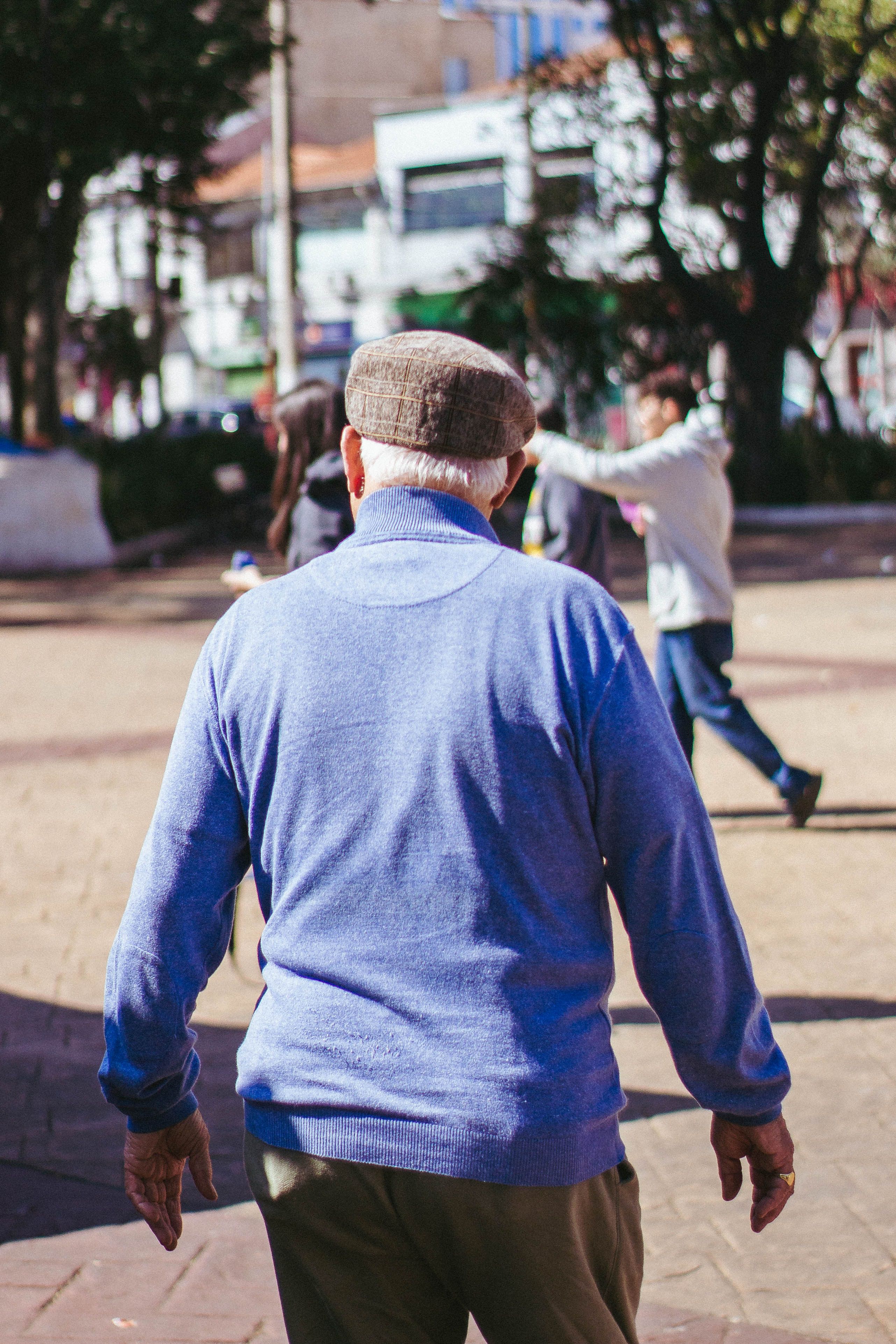 Man in Brown Long Sleeves Shirt Looking Down · Free Stock Photo