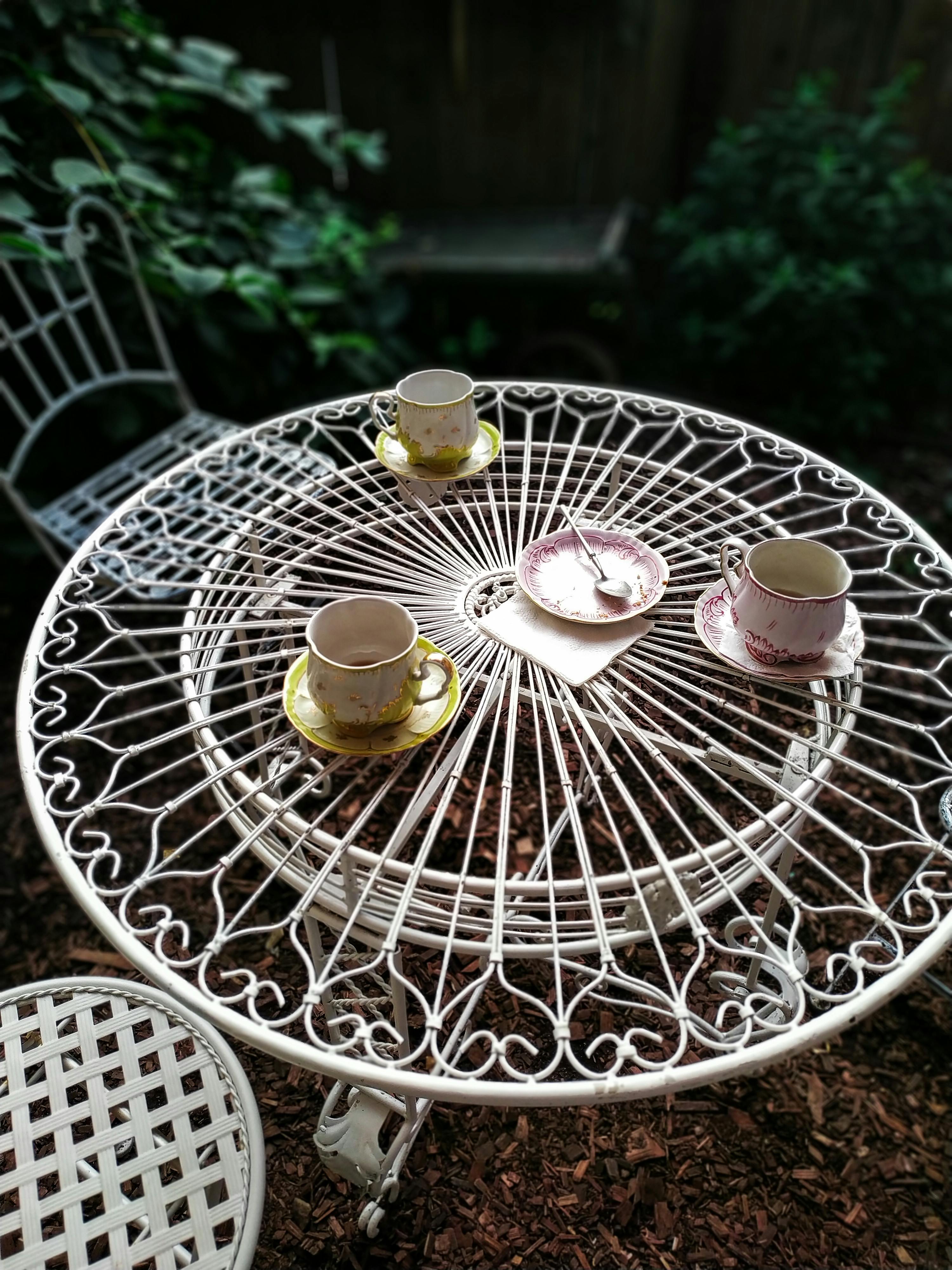 Folded Scarf on a Round Table Near White Wall · Free Stock Photo