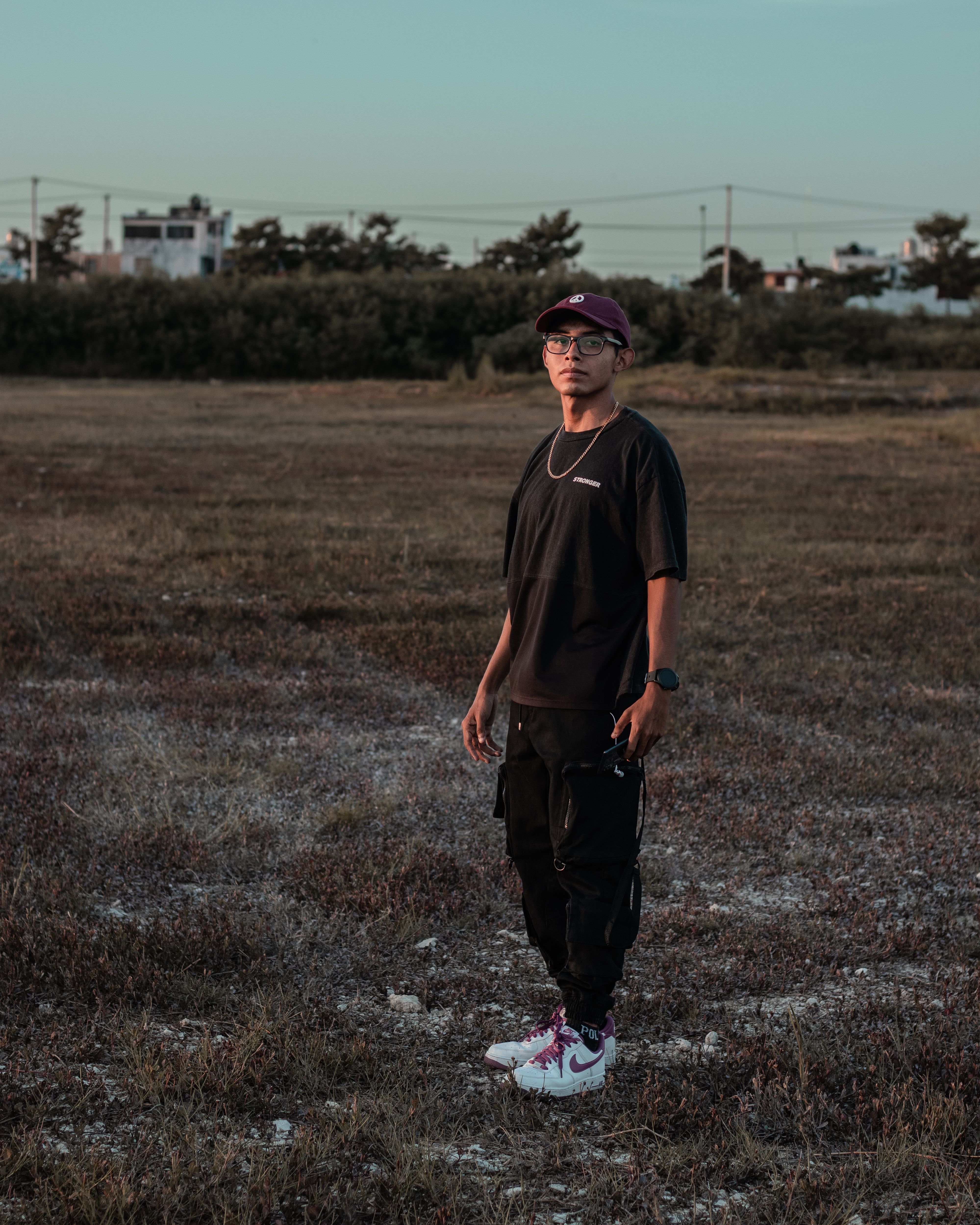Man in Red Polo Shirt and Black Pants Standing on Soccer Field · Free ...