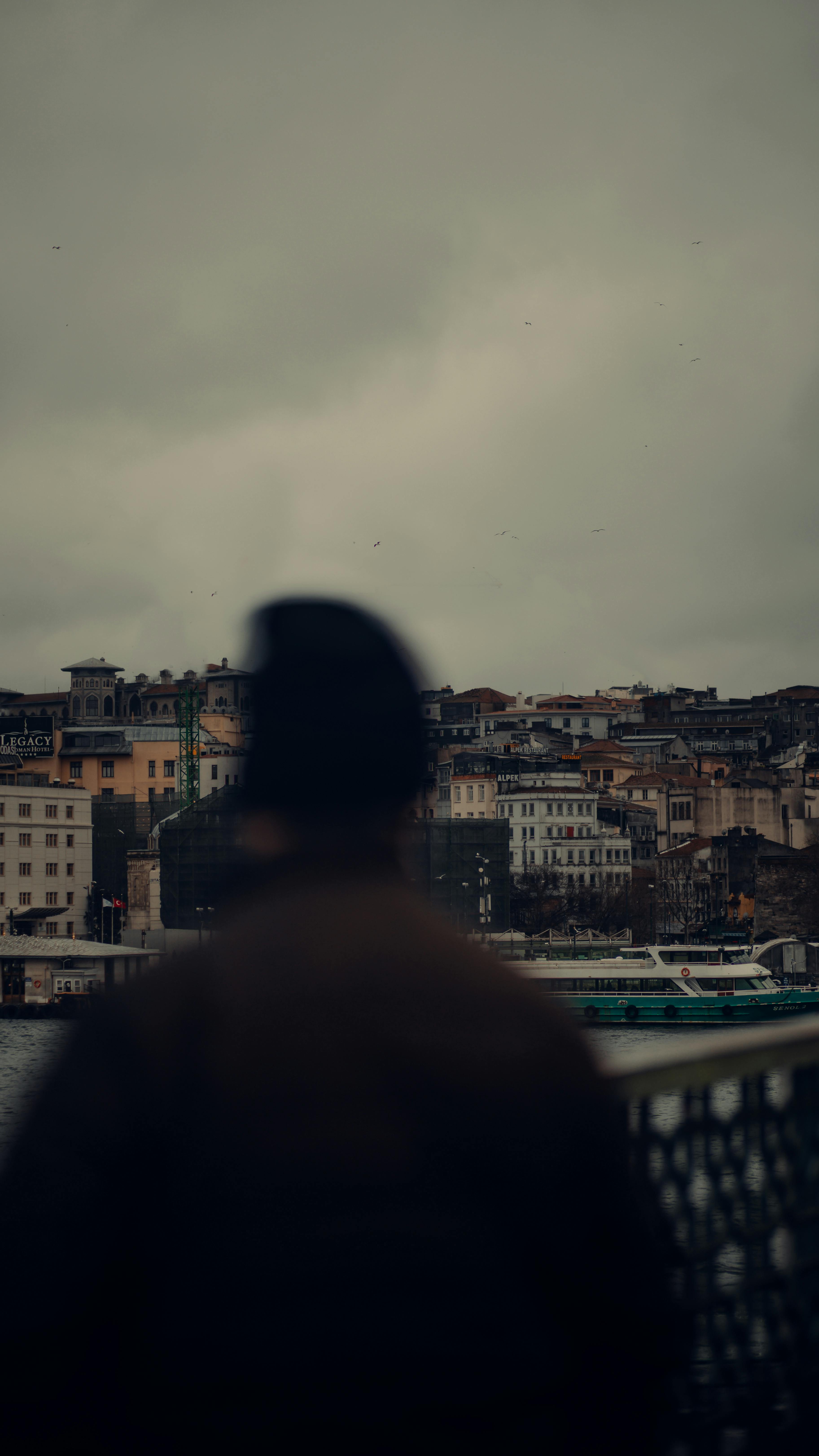 Person Looking at City Buildings · Free Stock Photo