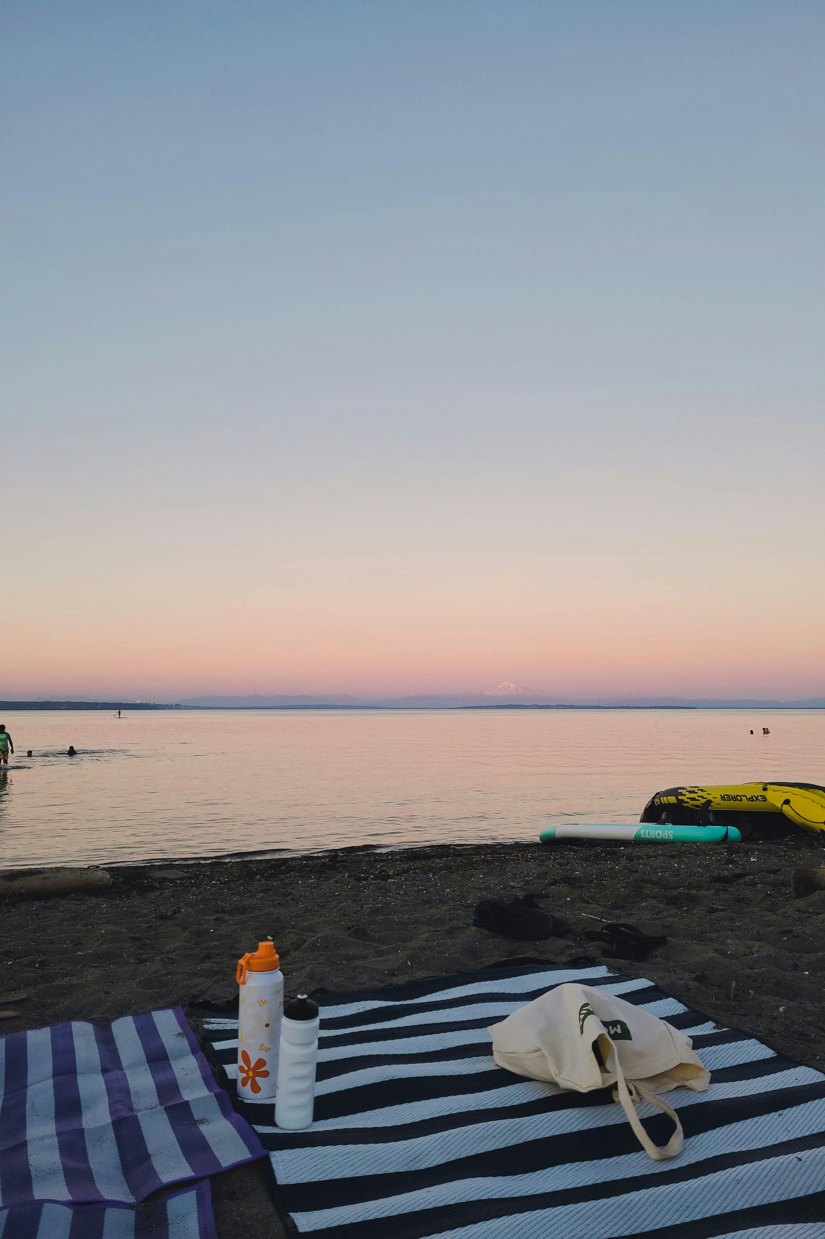 Picnic Blanket on the Beach during Sunset · Free Stock Photo